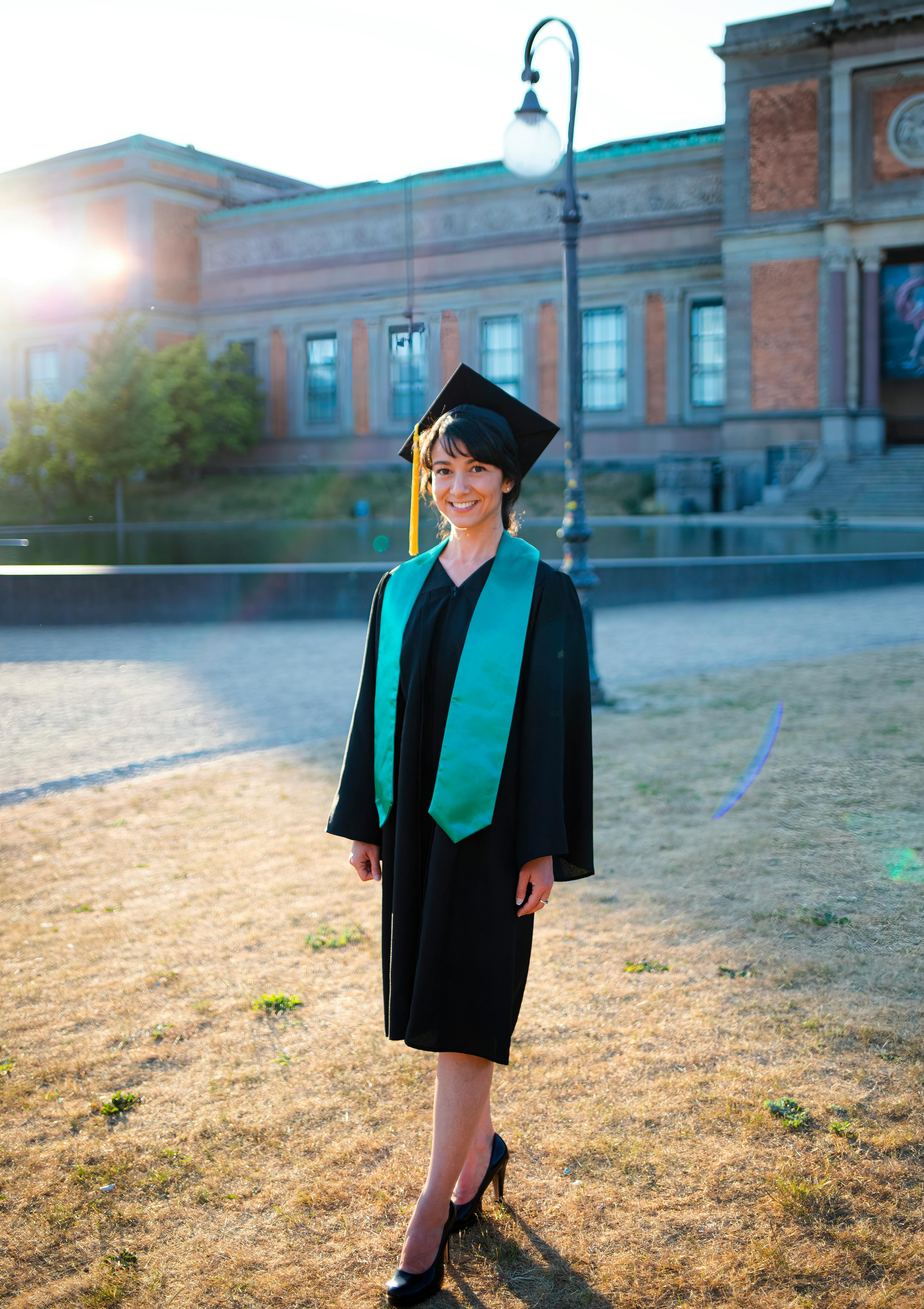 Smiling Graduates Throwing Up Academic Hats near UNAM Central Library ...