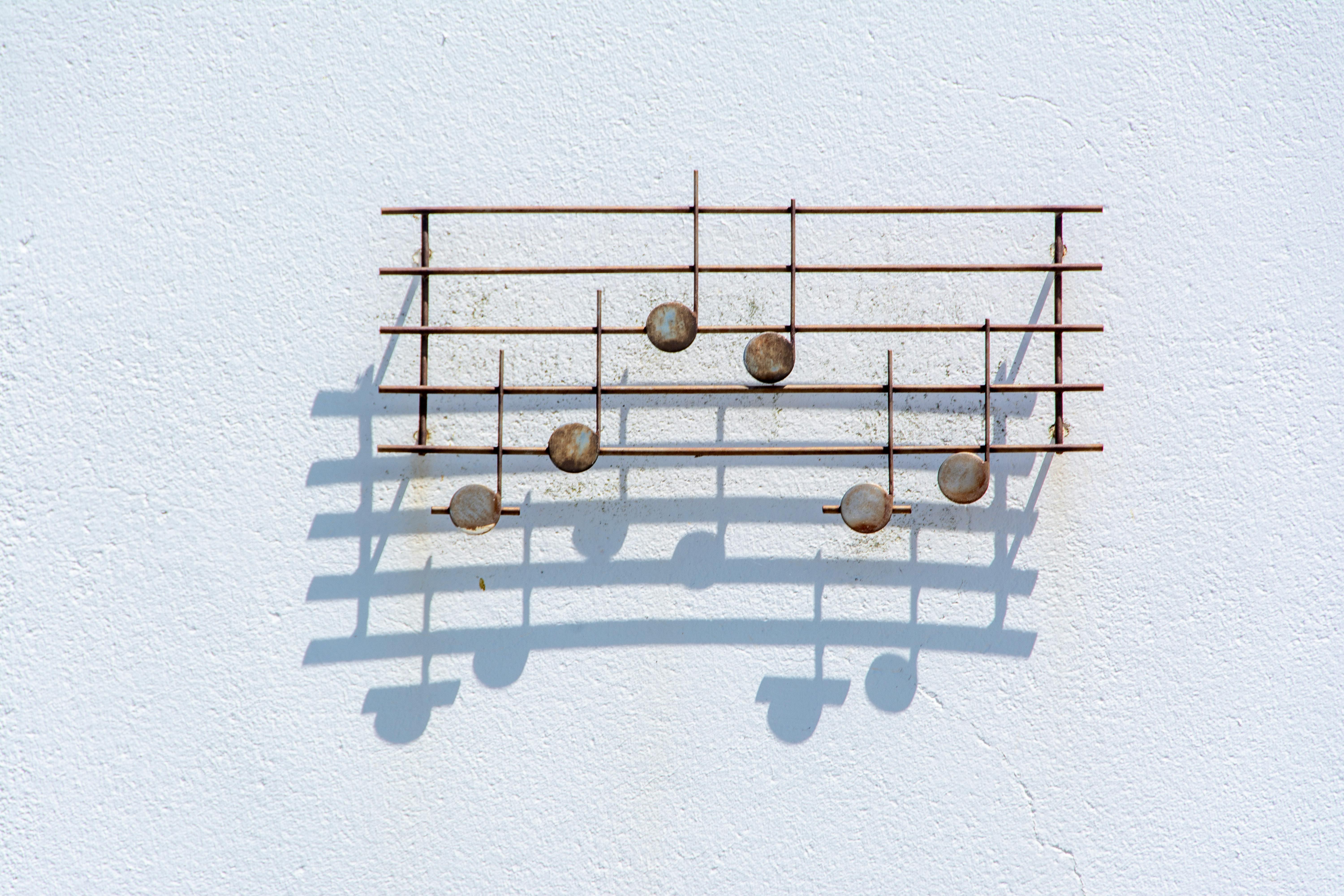 Music Notes Decoration on the White Wall · Free Stock Photo