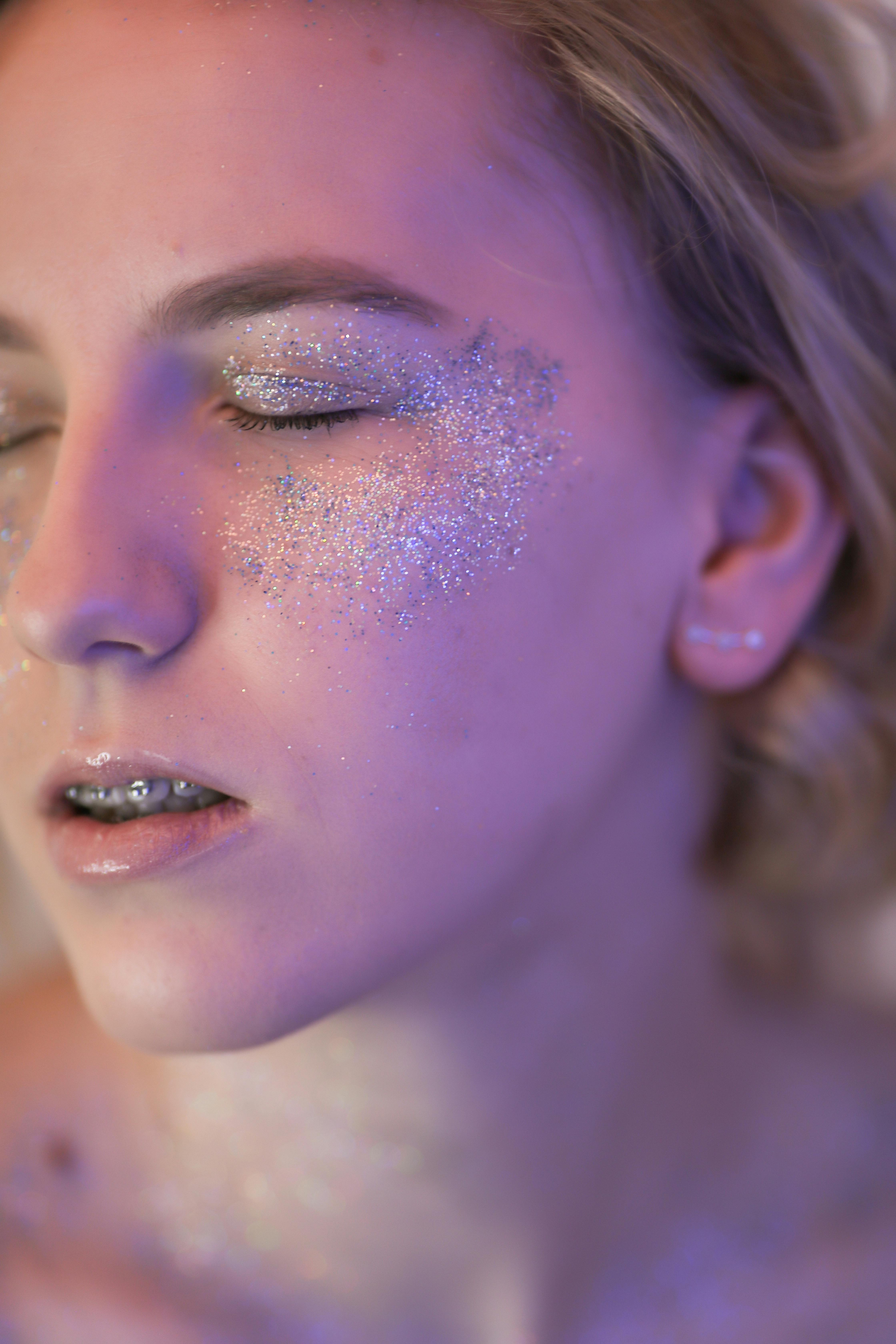 Portrait of a Young Woman with Glitter on her Face · Free Stock Photo