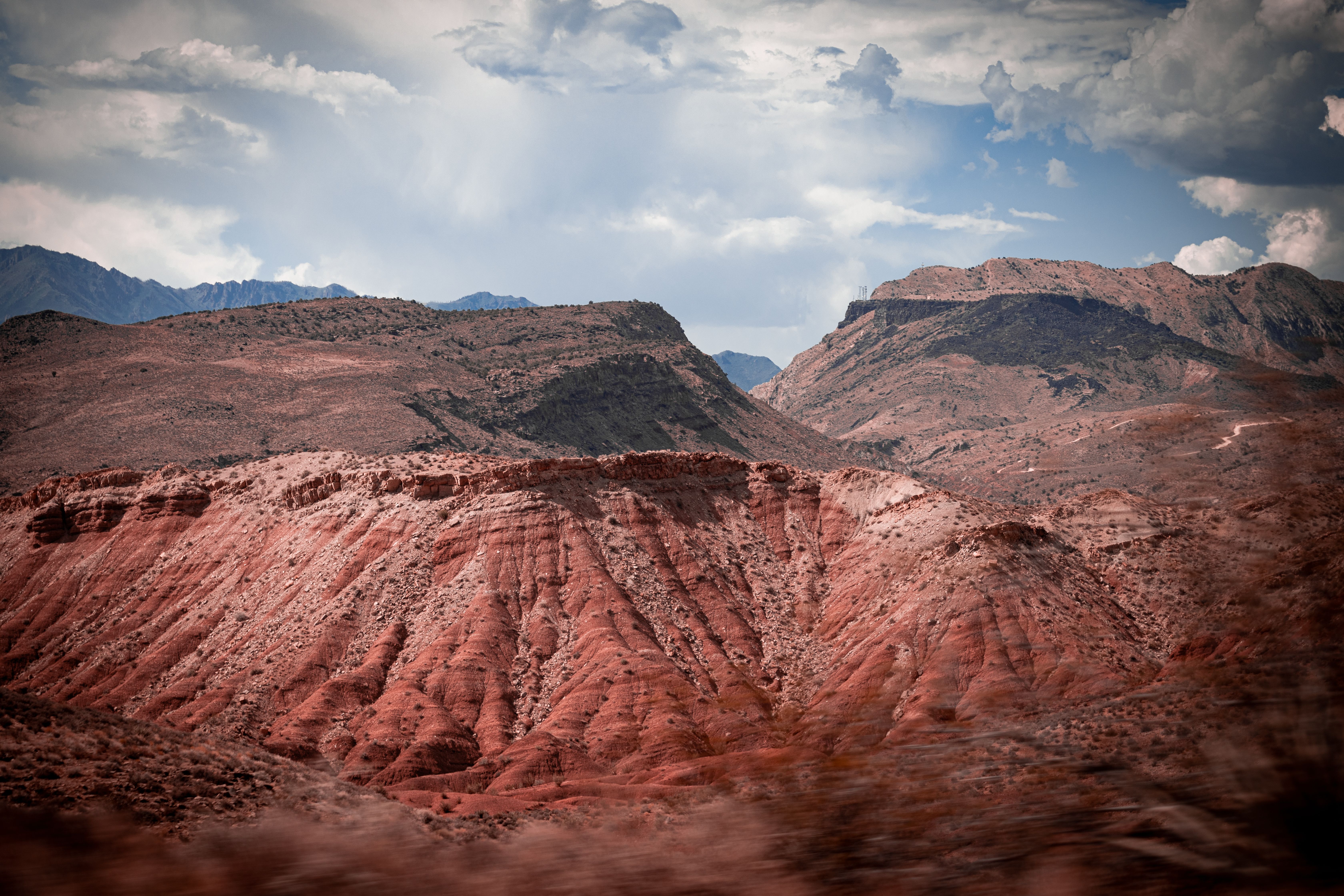 A red landscape with mountains in the background · Free Stock Photo
