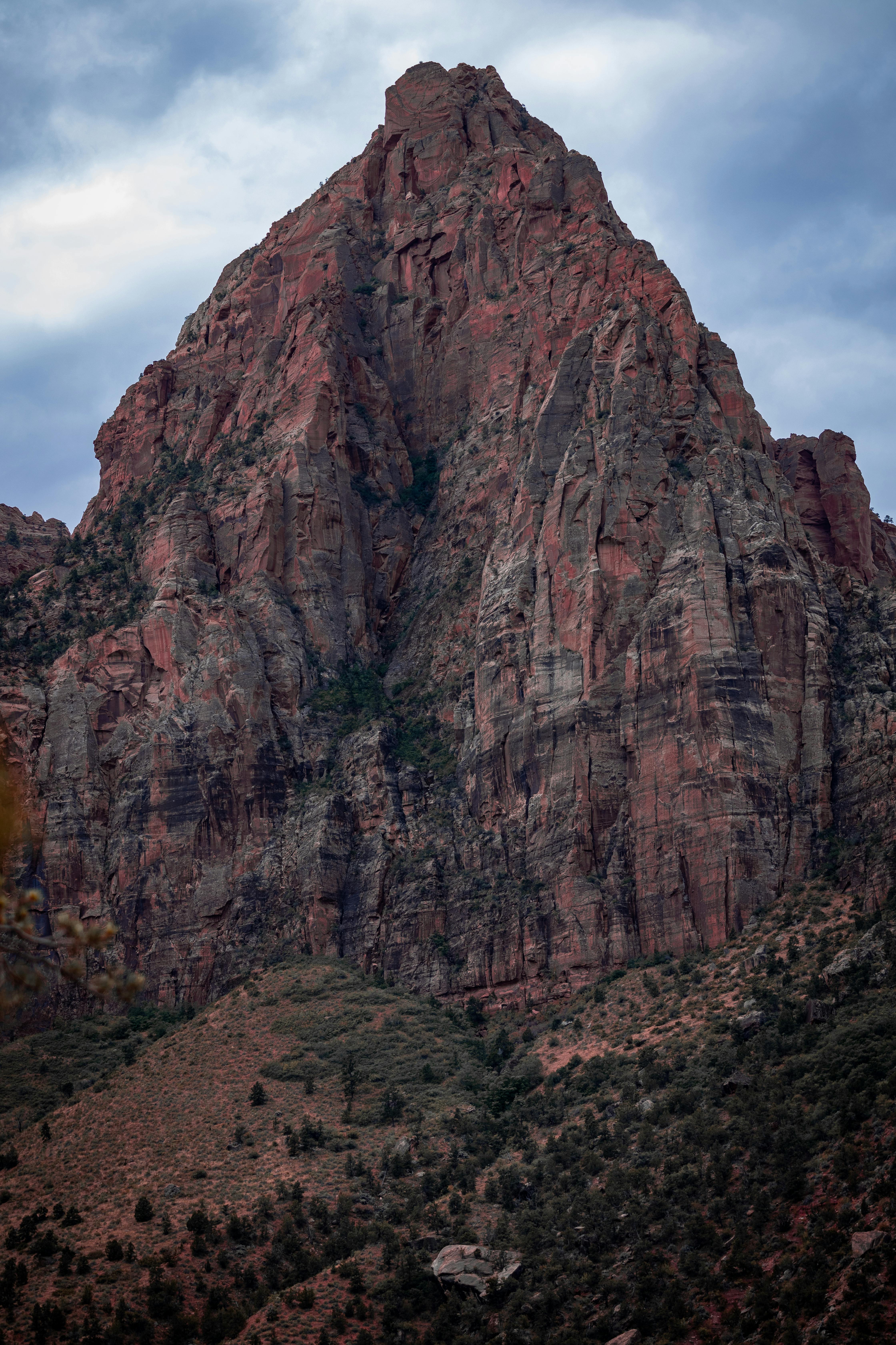 A large rock formation with a red color · Free Stock Photo
