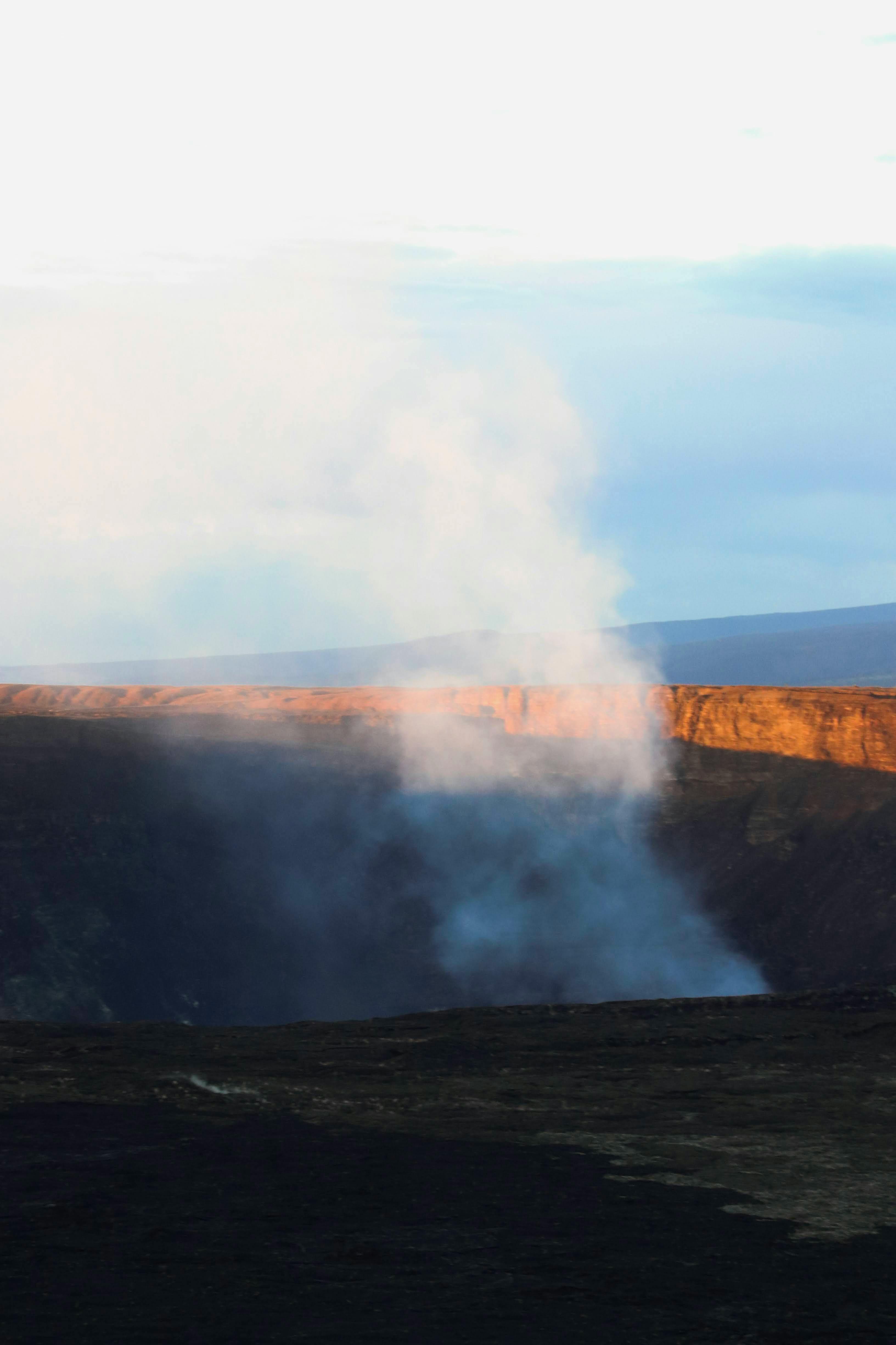 Steam from Crater with Rocks around · Free Stock Photo