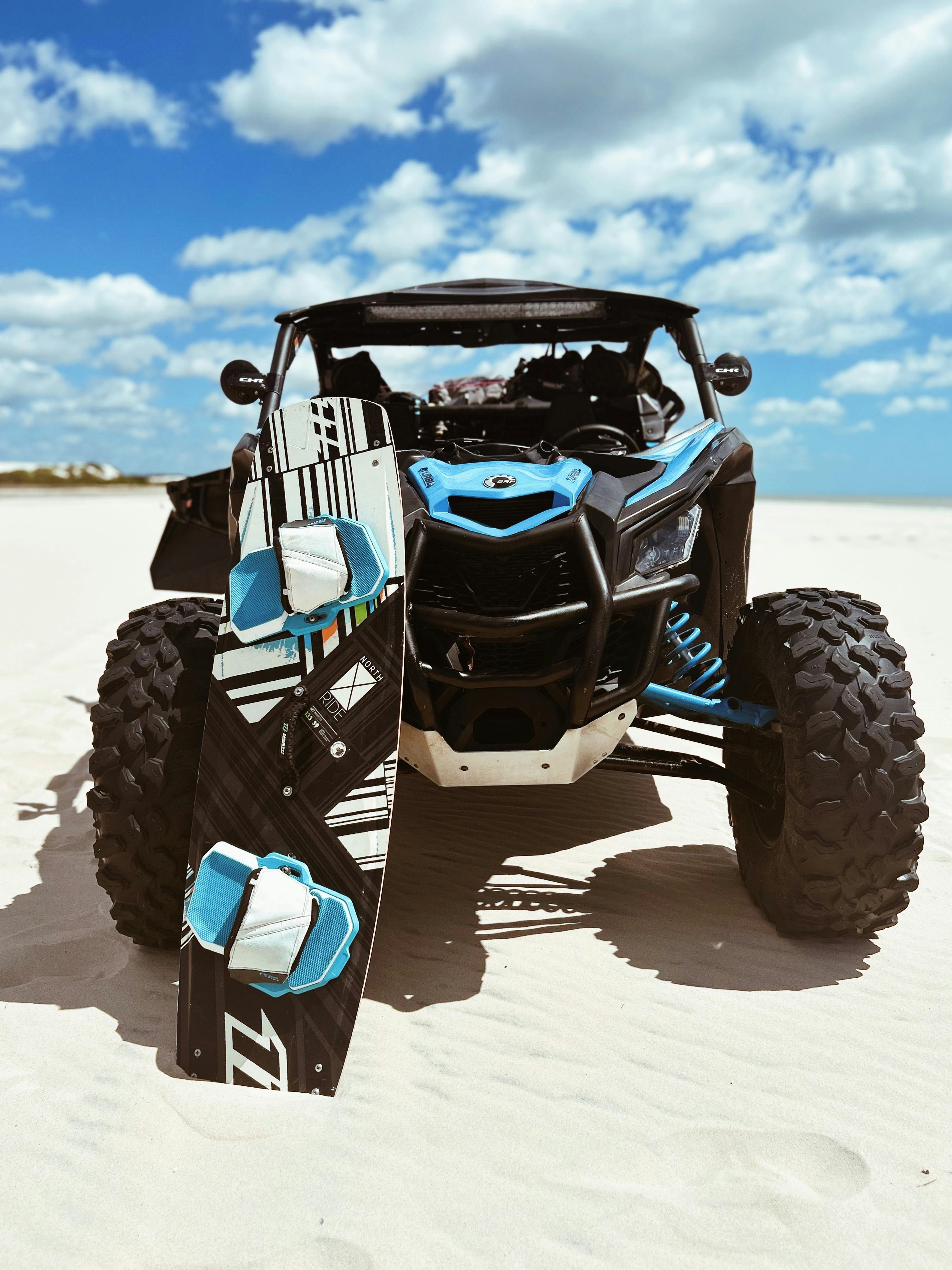 A Beach Buggy and a Windsurfing Board on the Beach · Free Stock Photo