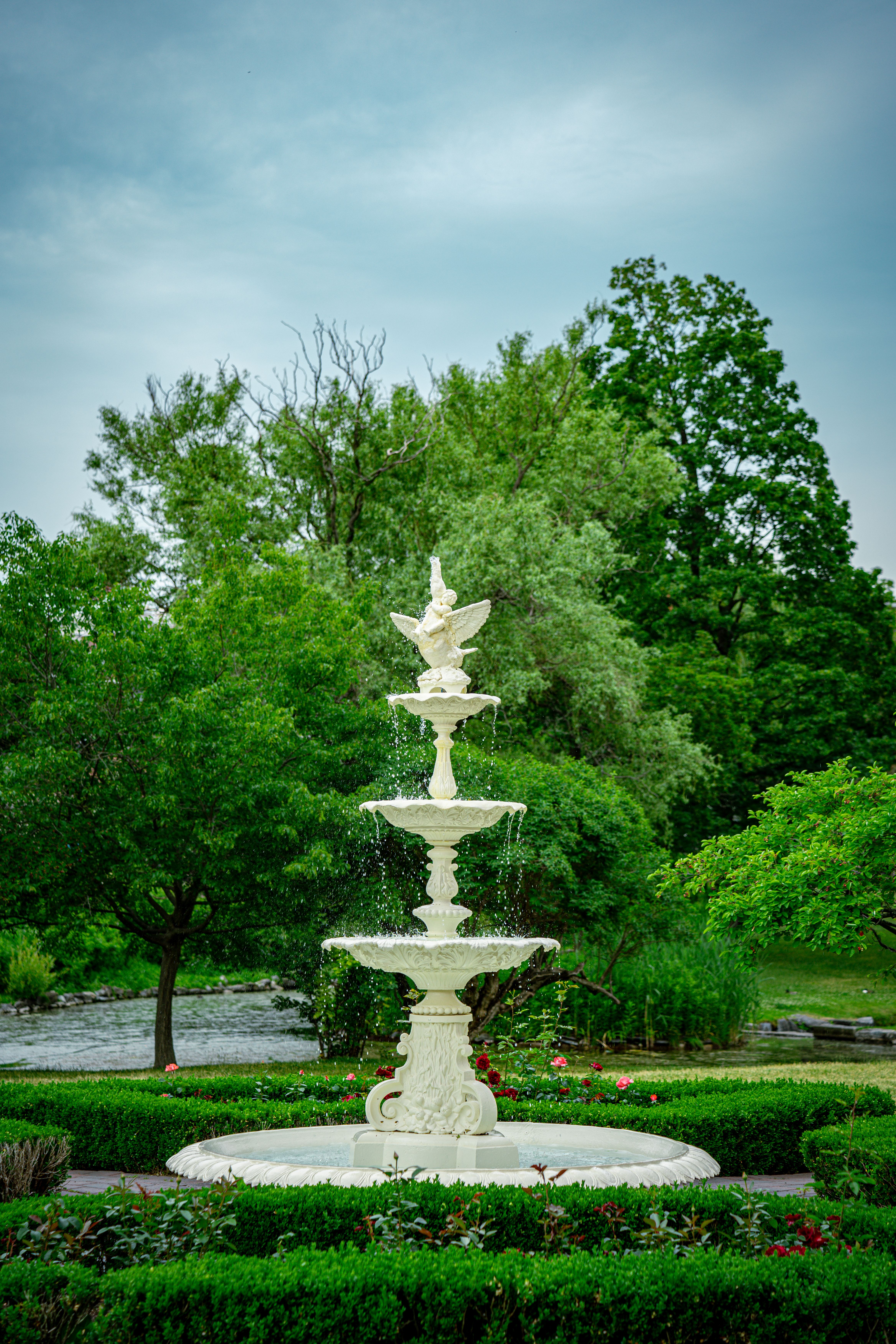 A Fountain in a Park among Green Trees · Free Stock Photo
