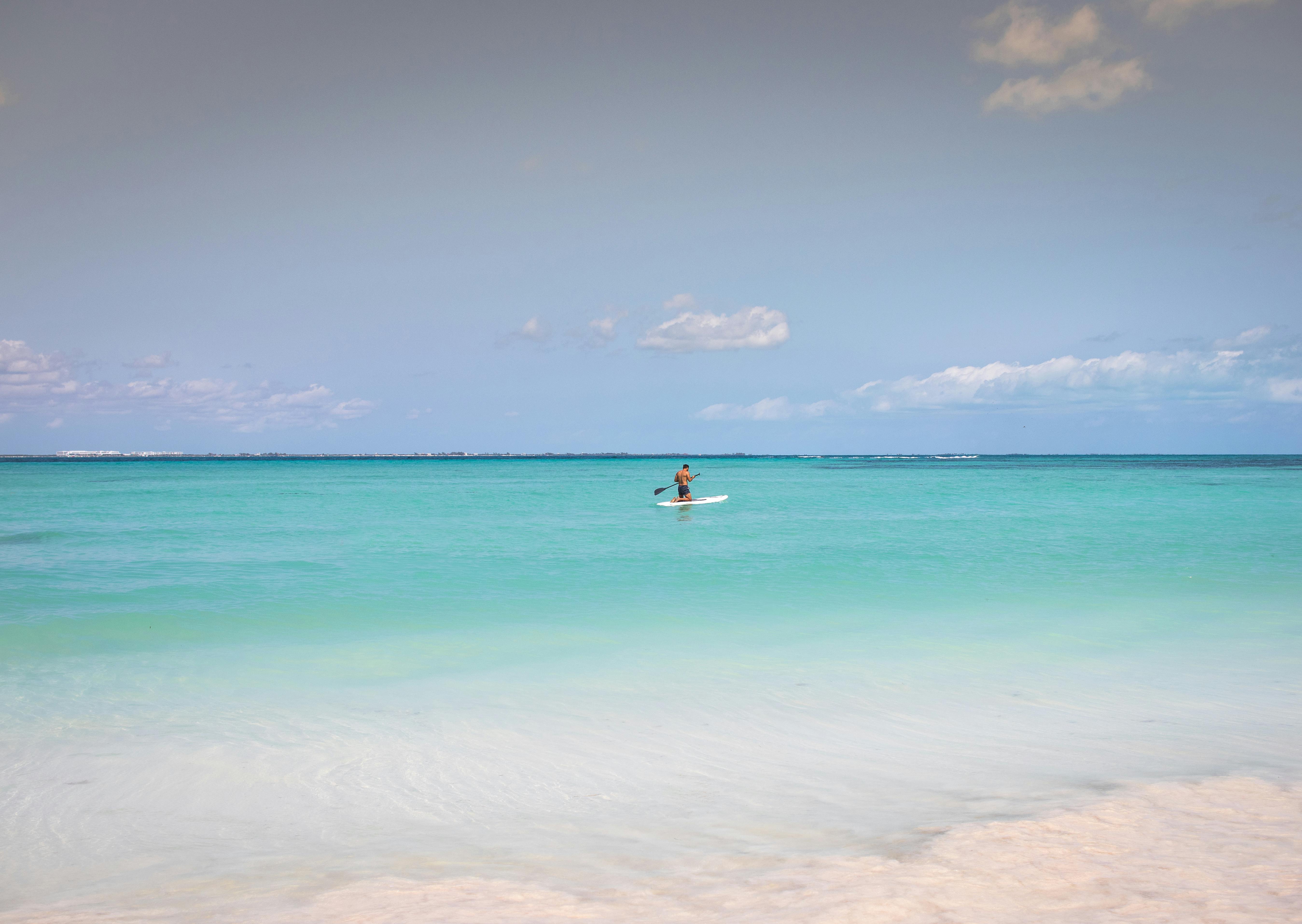 Man on Surfboard at Sea · Free Stock Photo