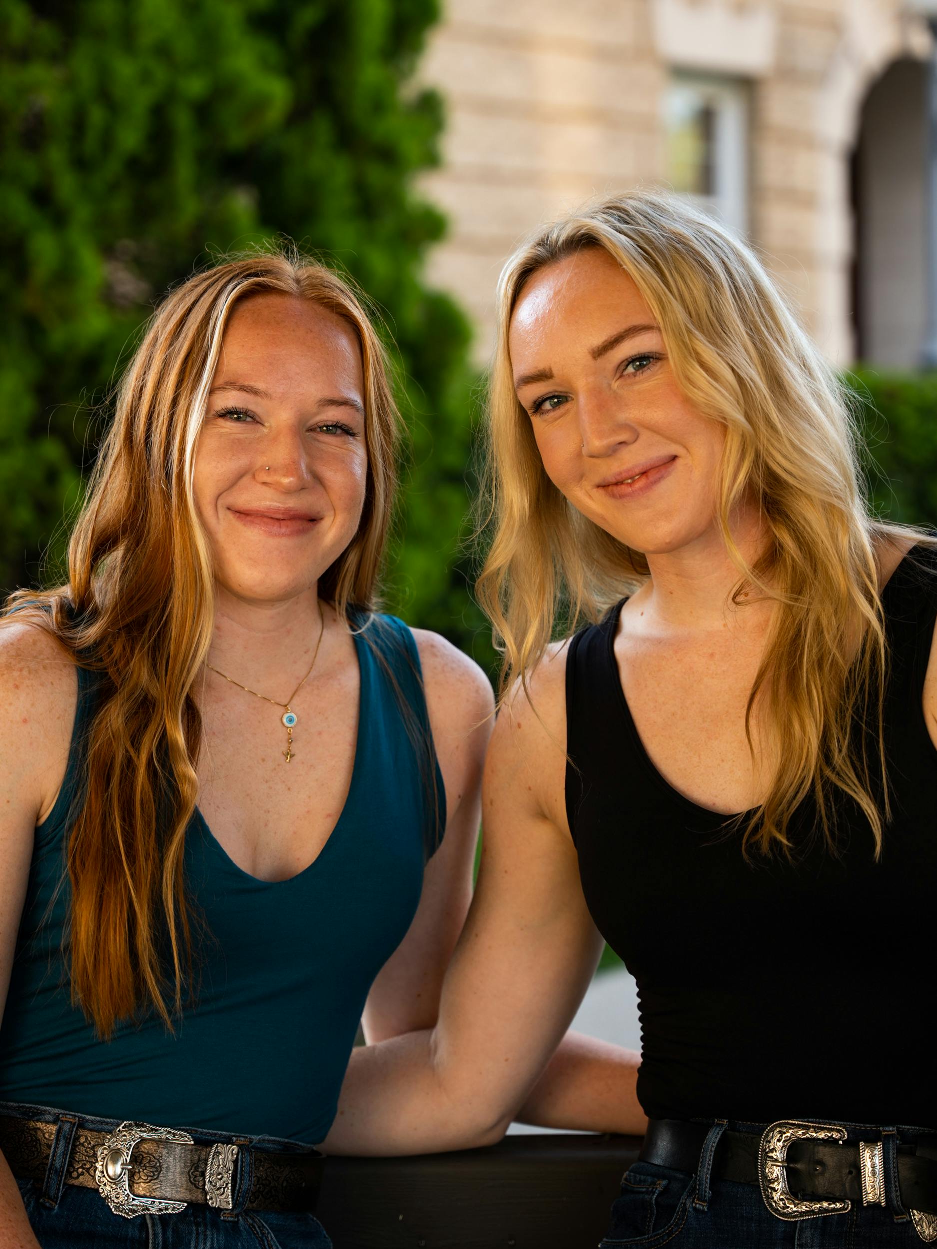 Two Smiling Girls in Matching Outfits · Free Stock Photo