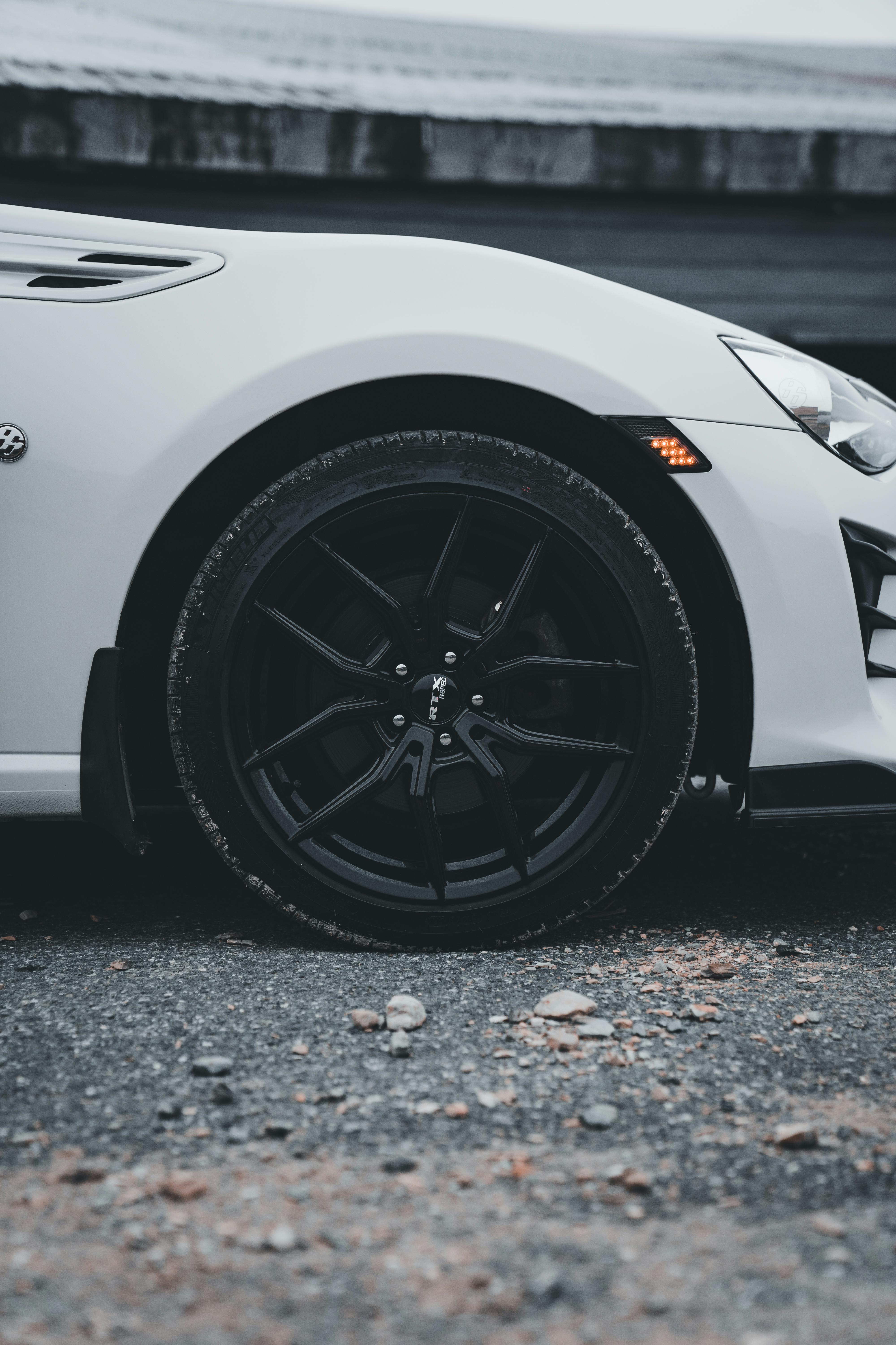 White Sports Car Parked Outside · Free Stock Photo