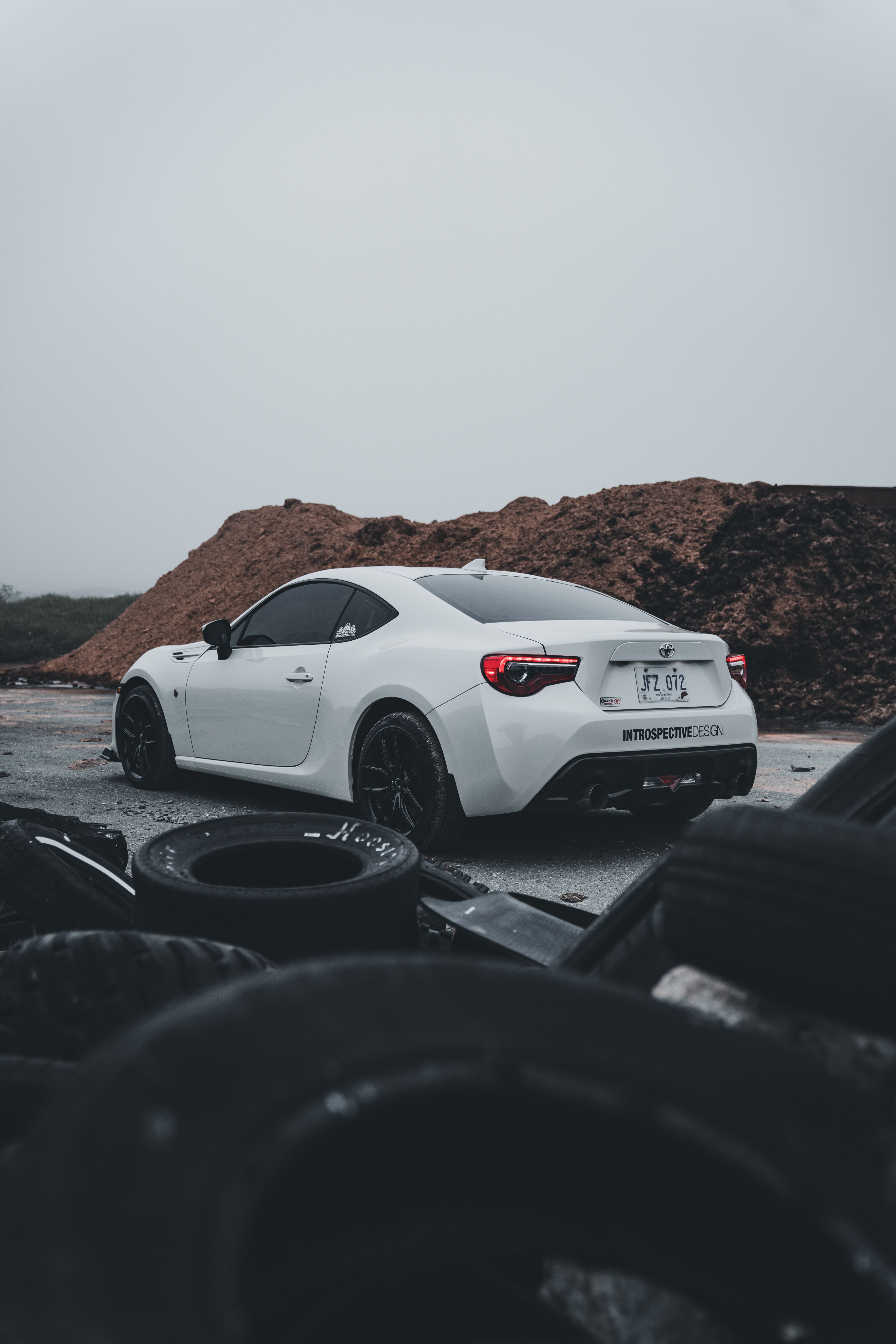 White Toyota Car Parked Near Body of Water · Free Stock Photo