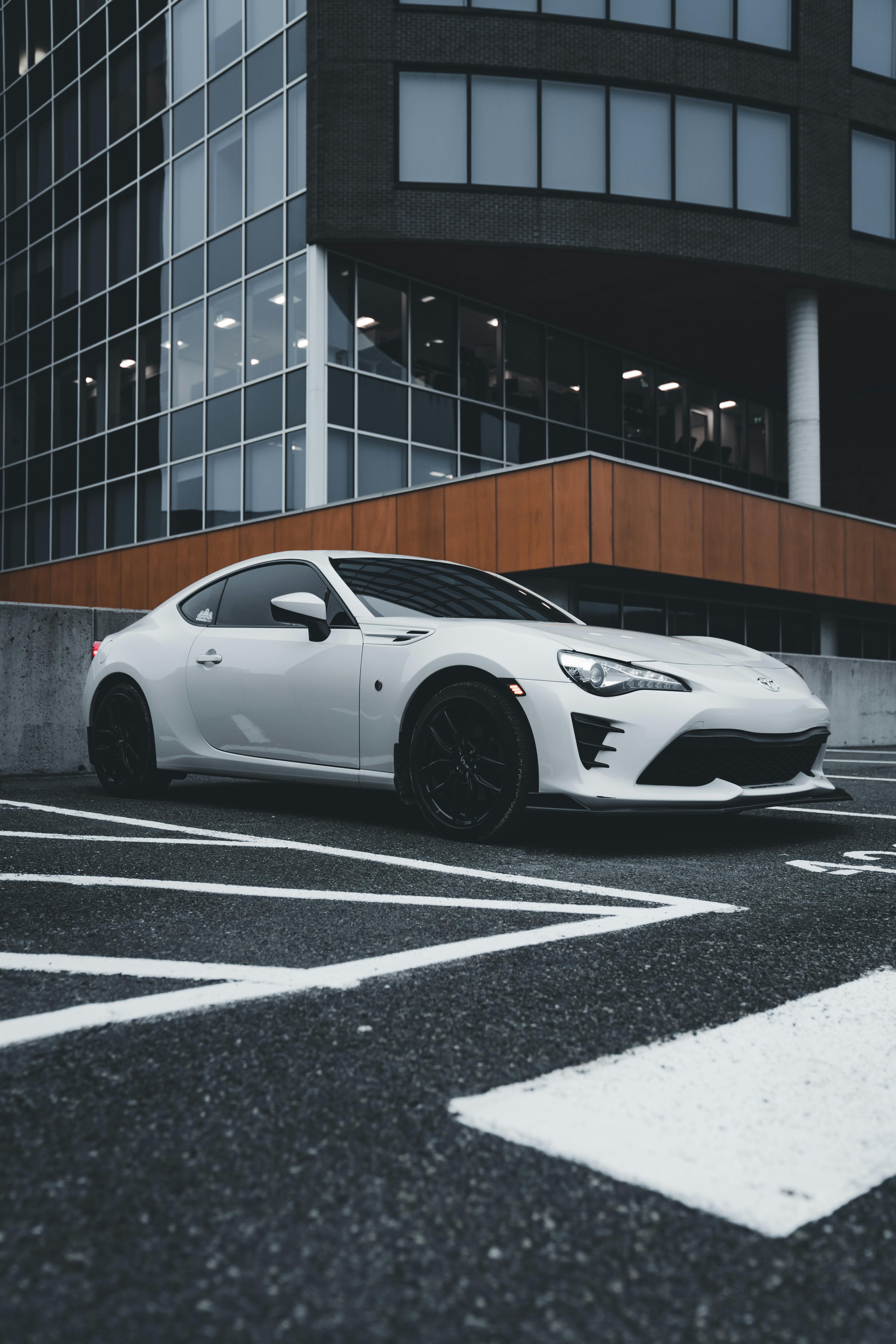 White Toyota 86 Parked in a Residential Courtyard · Free Stock Photo