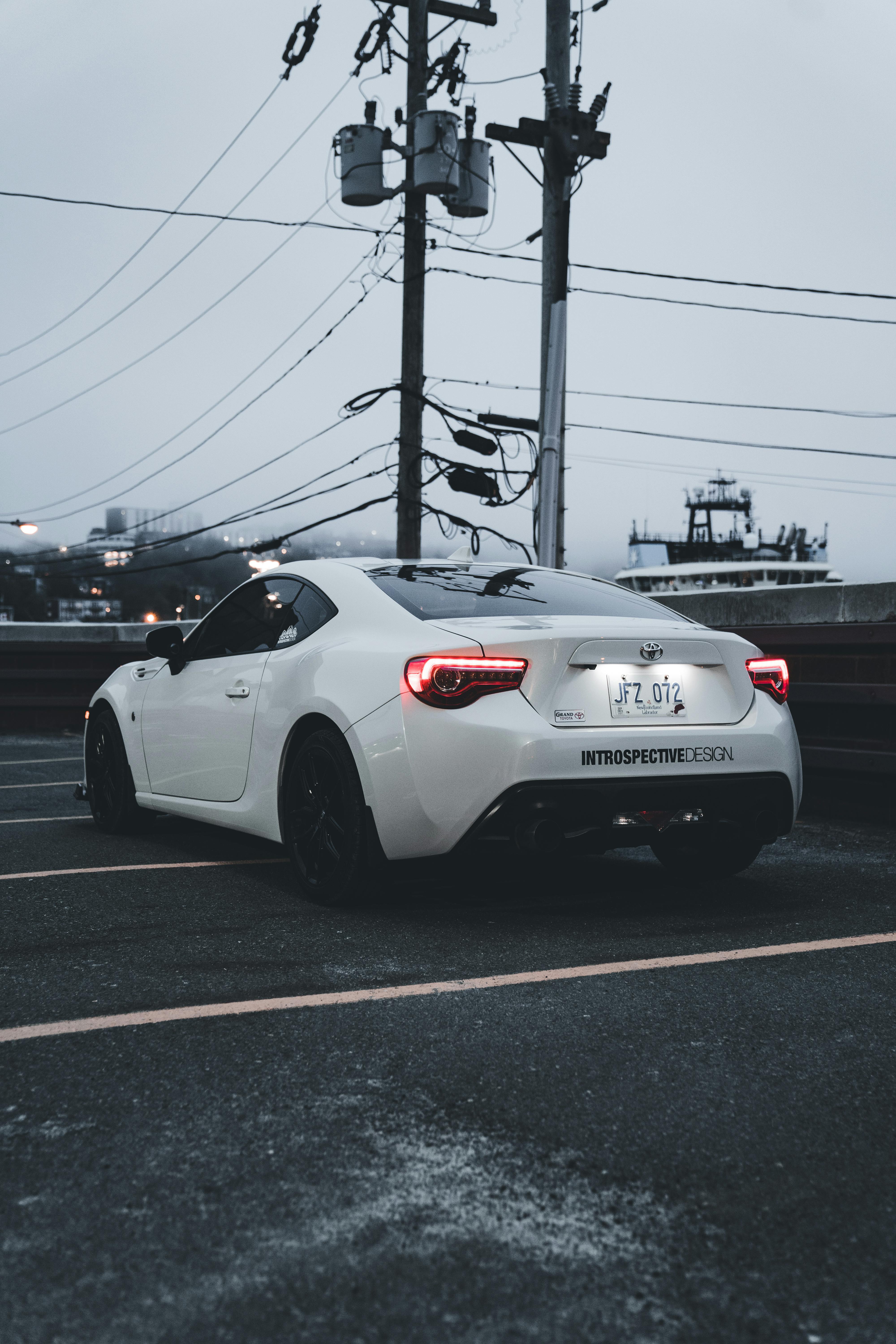 Back of a Red Toyota GR86 on an Asphalt Road · Free Stock Photo