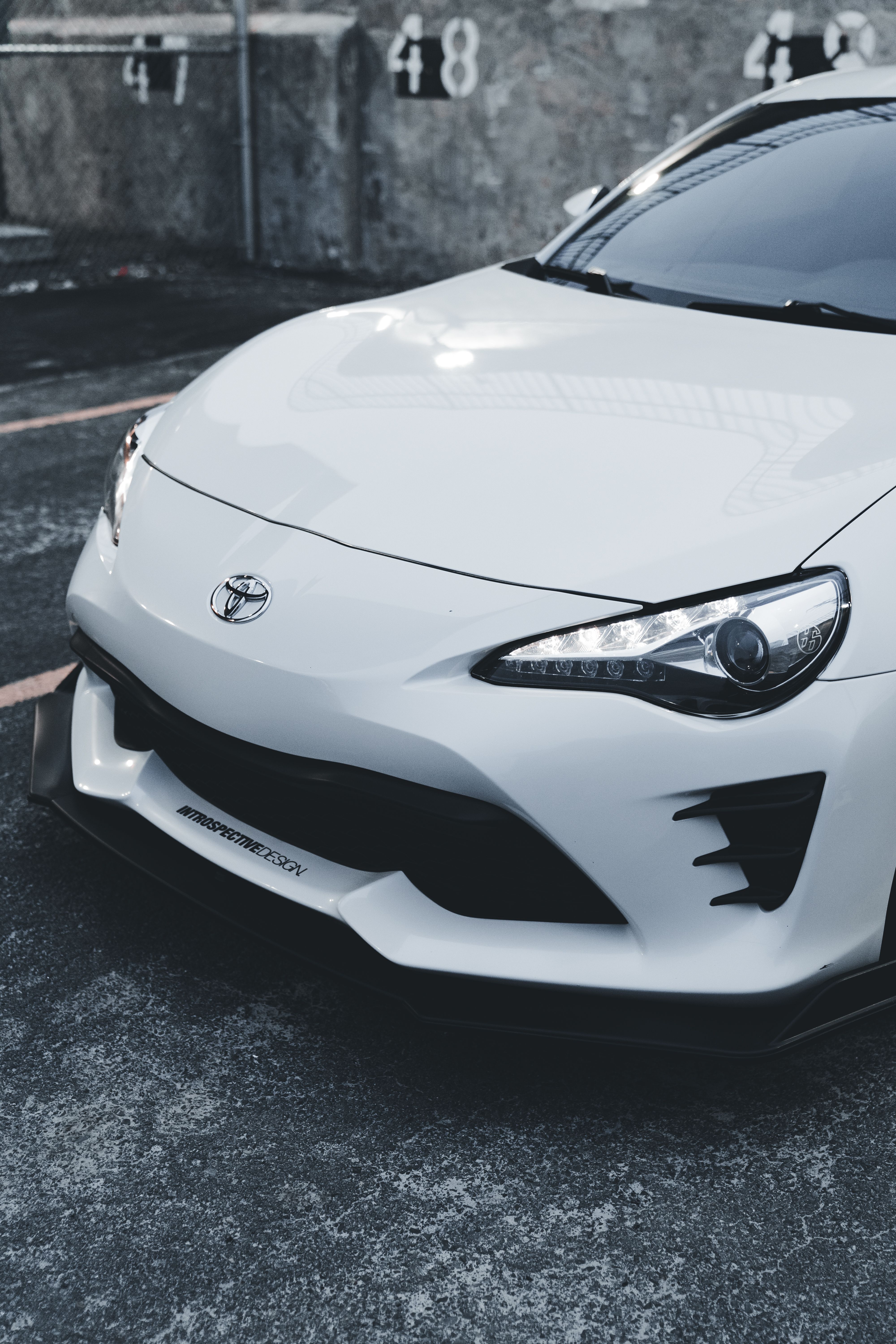 Back of a Red Toyota GR86 on an Asphalt Road · Free Stock Photo