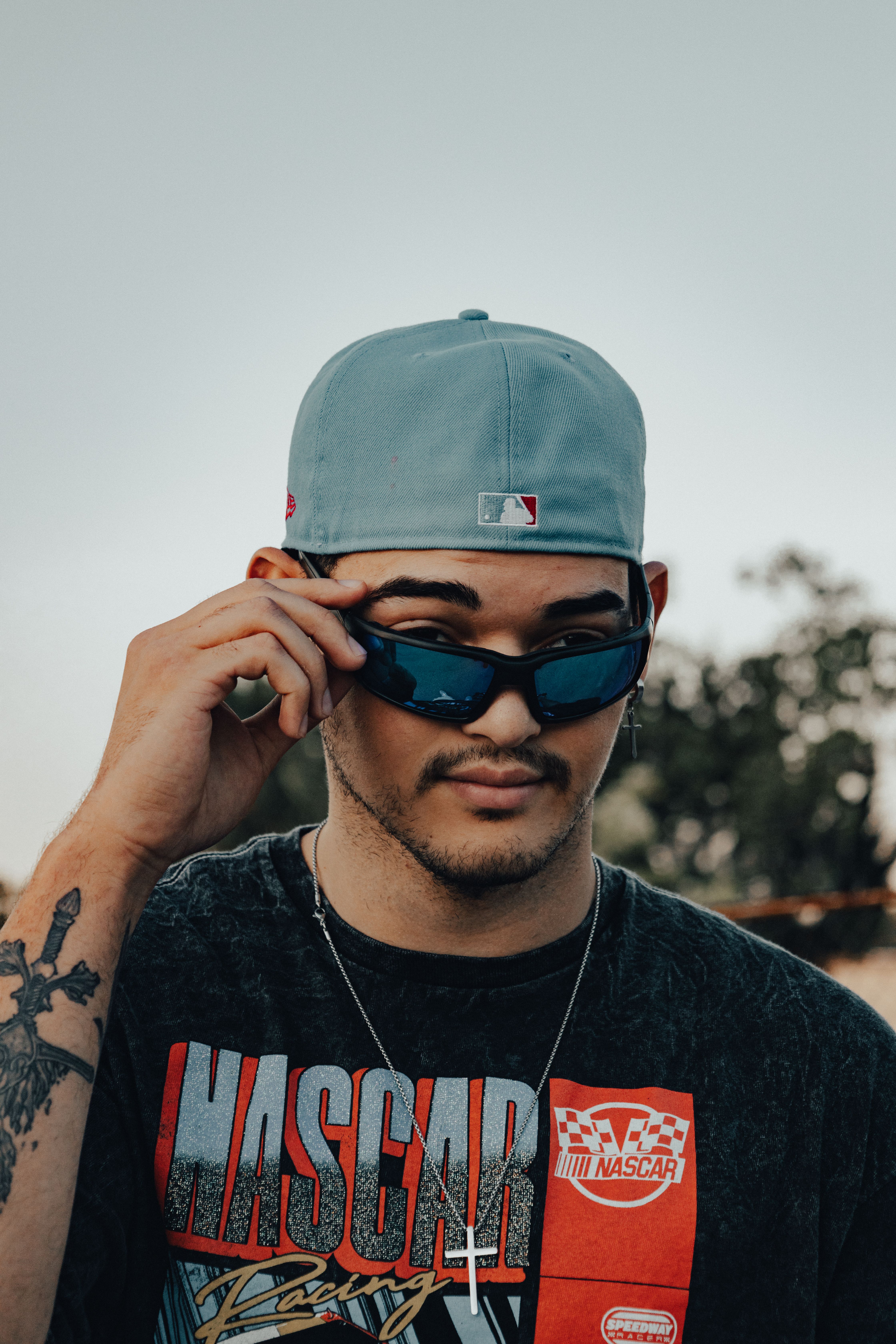 Smiling Man Wearing Black Snapback Cap and Black Crew-neck Shirt · Free ...