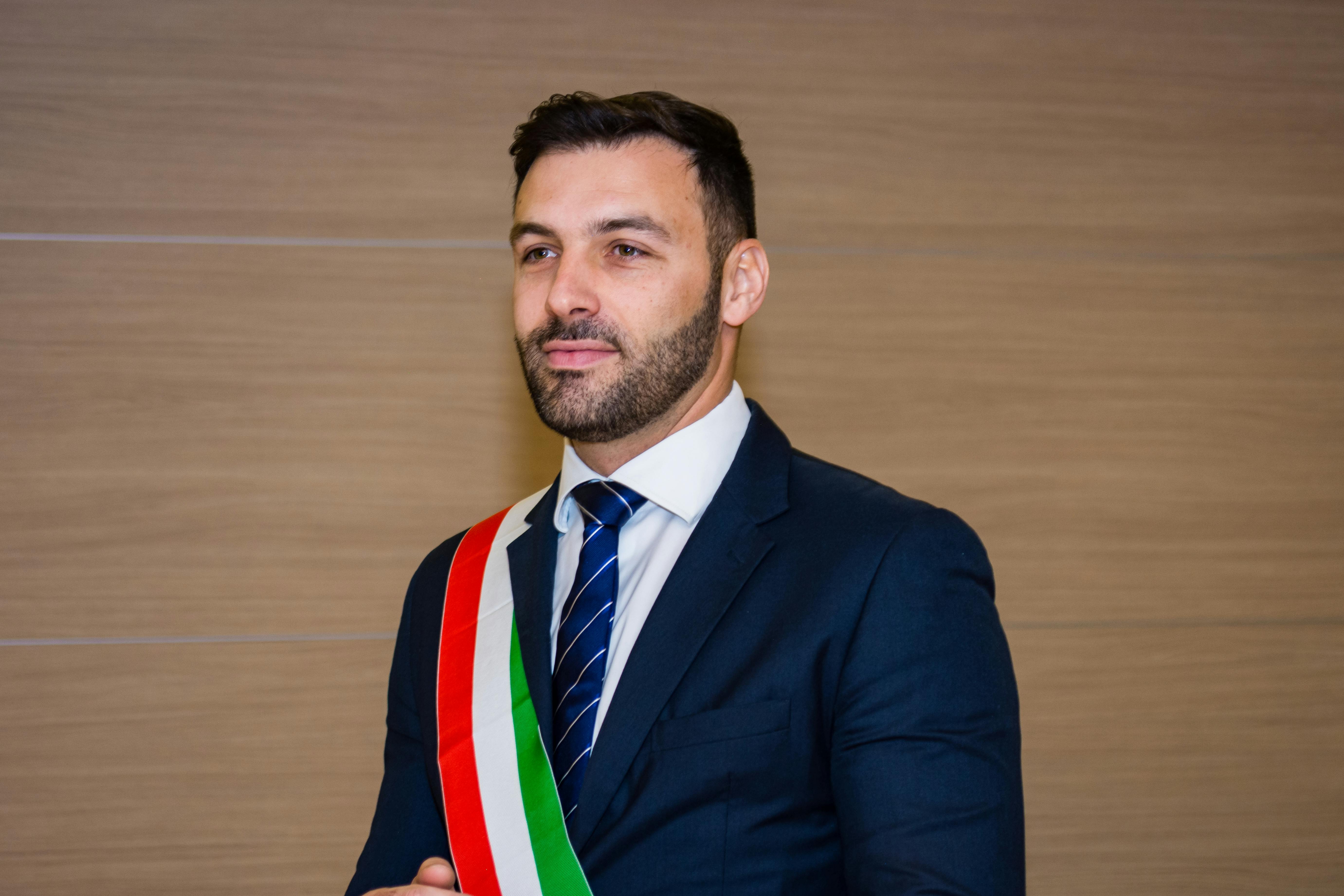 Man in a Suit Wearing a Sash with Italian Colors · Free Stock Photo