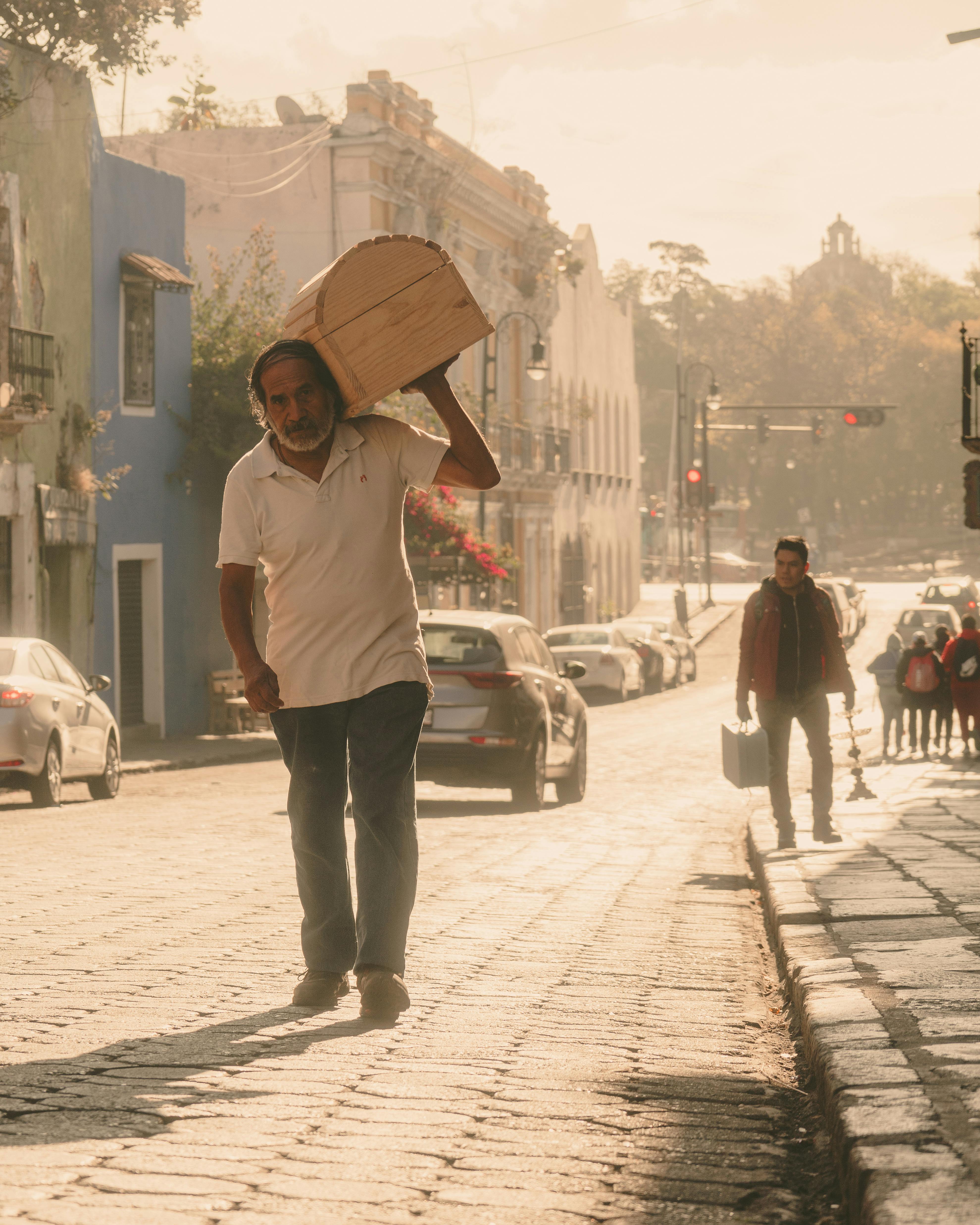Man Carrying Wooden Chest · Free Stock Photo