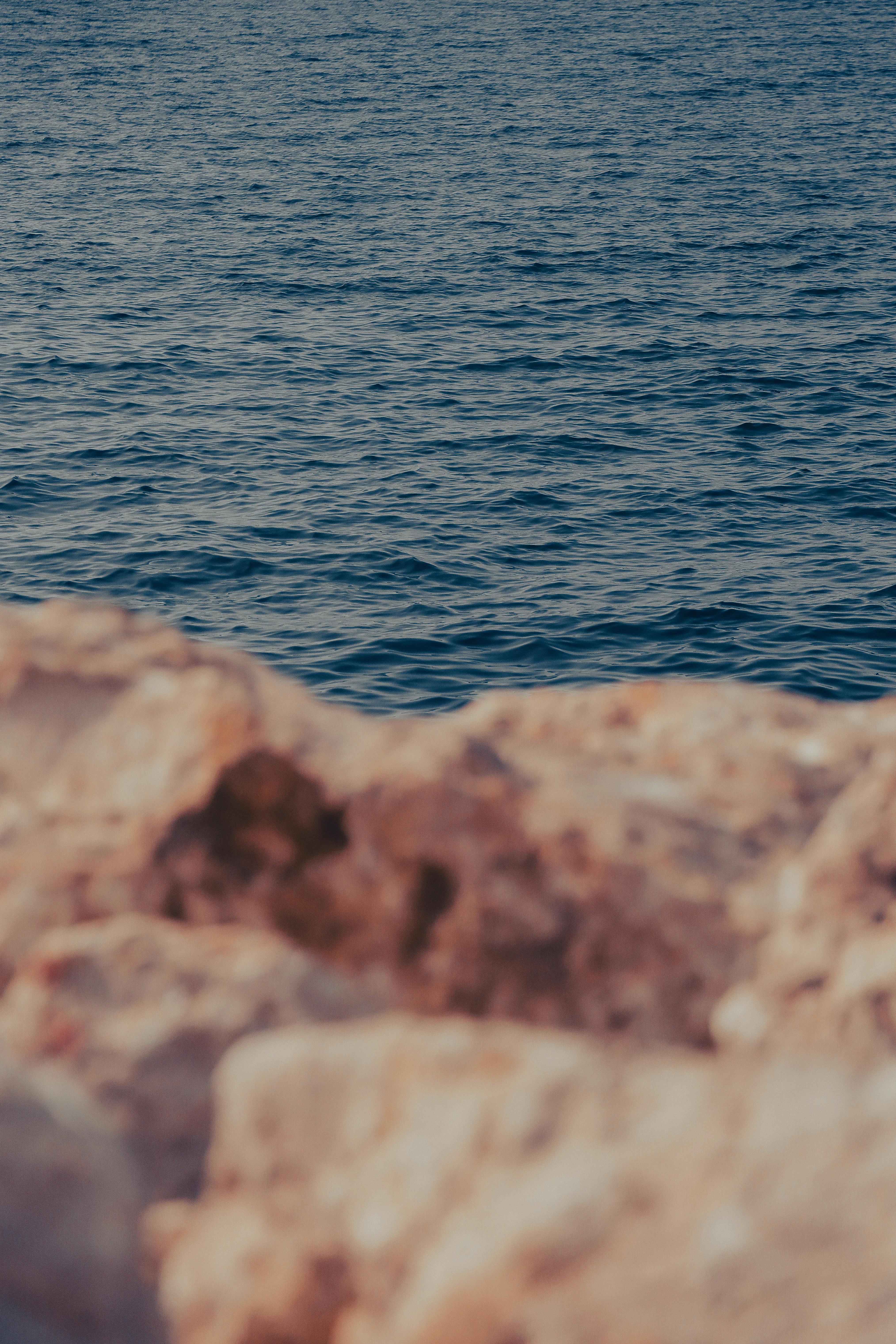 Waving Sea and Blurred Rock · Free Stock Photo