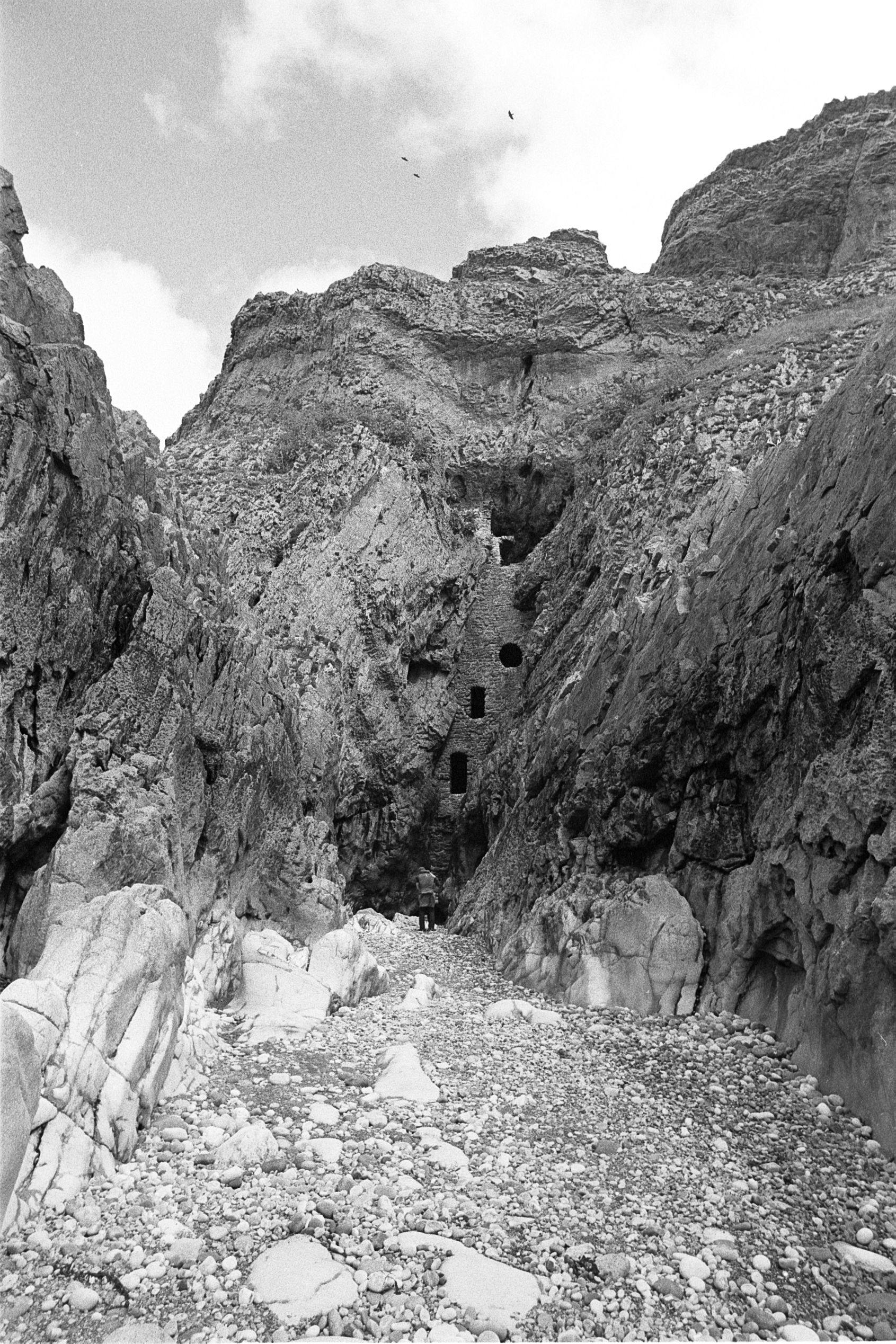 Building Carved in Rocks in Black and White · Free Stock Photo
