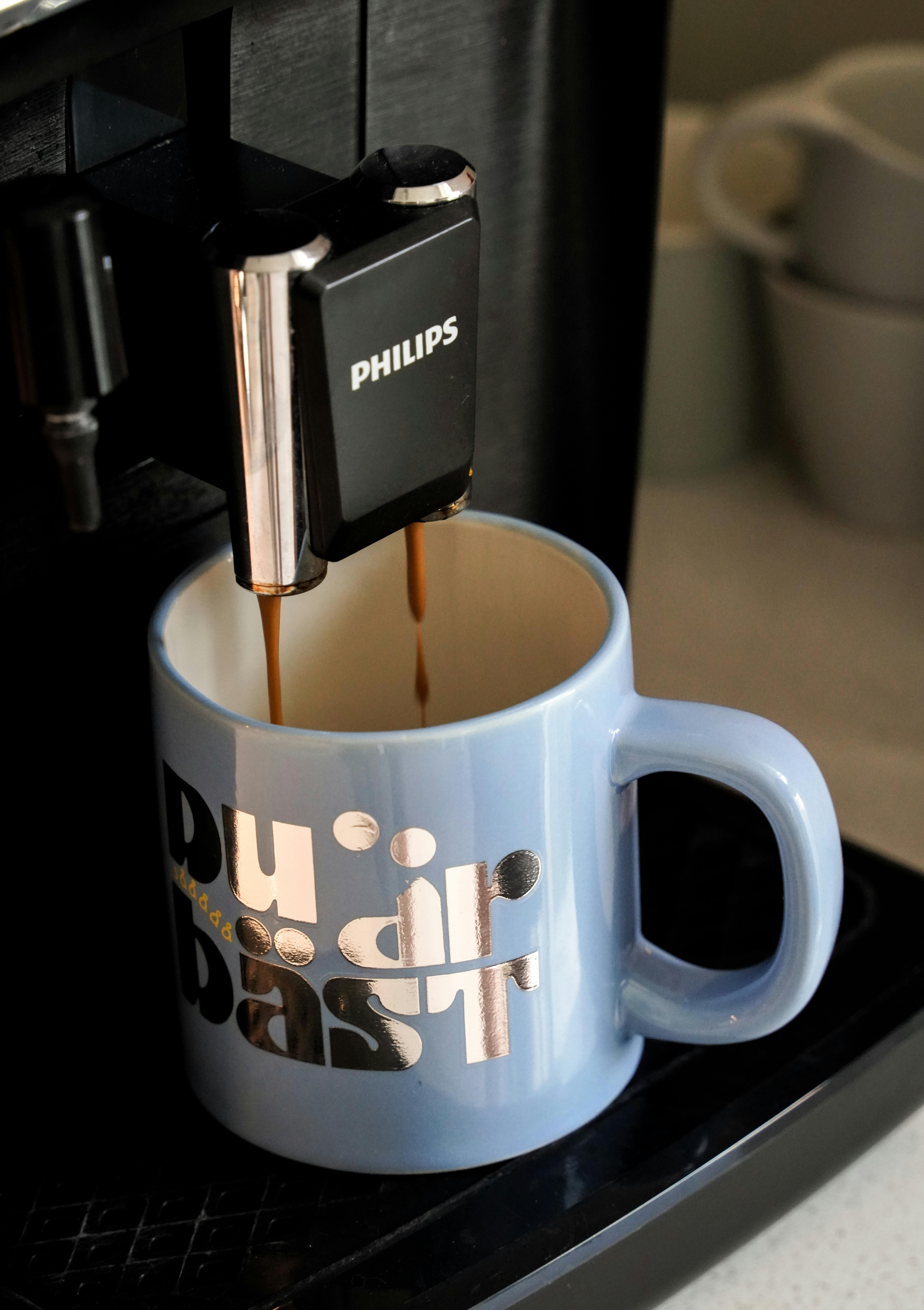 Coffee Maker Pouring Coffee in Mug · Free Stock Photo
