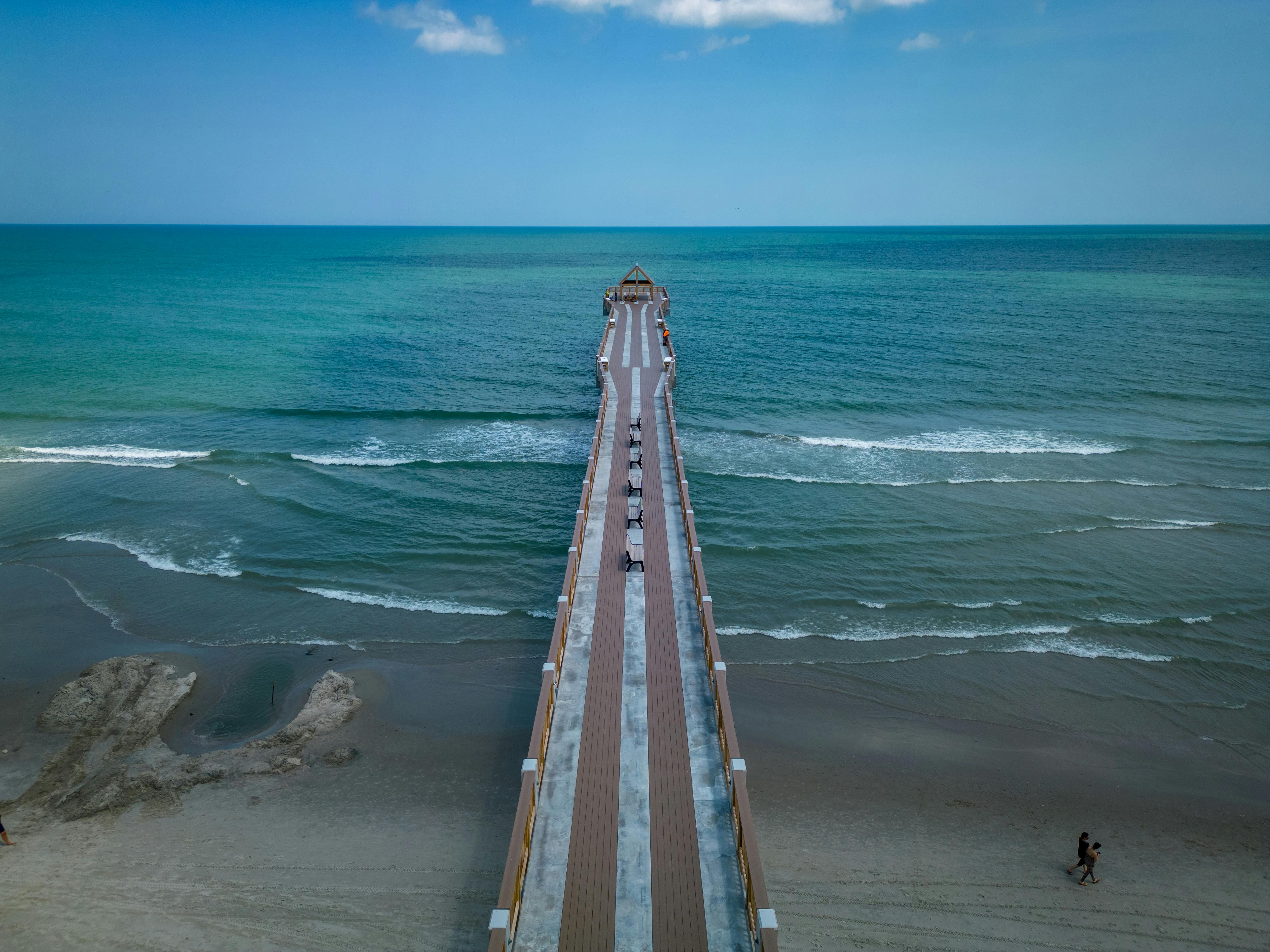 Drone Shot of Pier in Blue Sea · Free Stock Photo