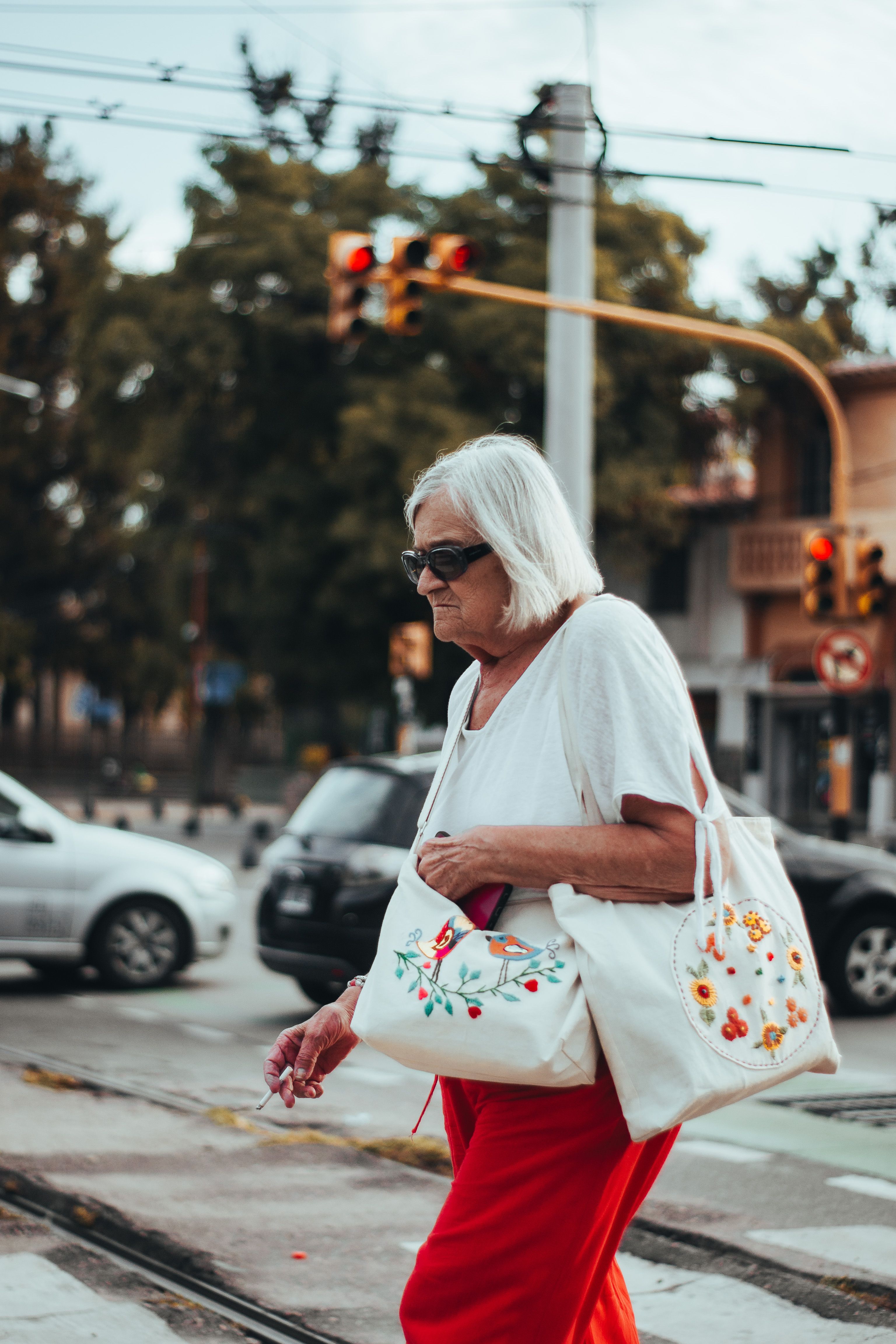 Old Woman Crossing City Road · Free Stock Photo