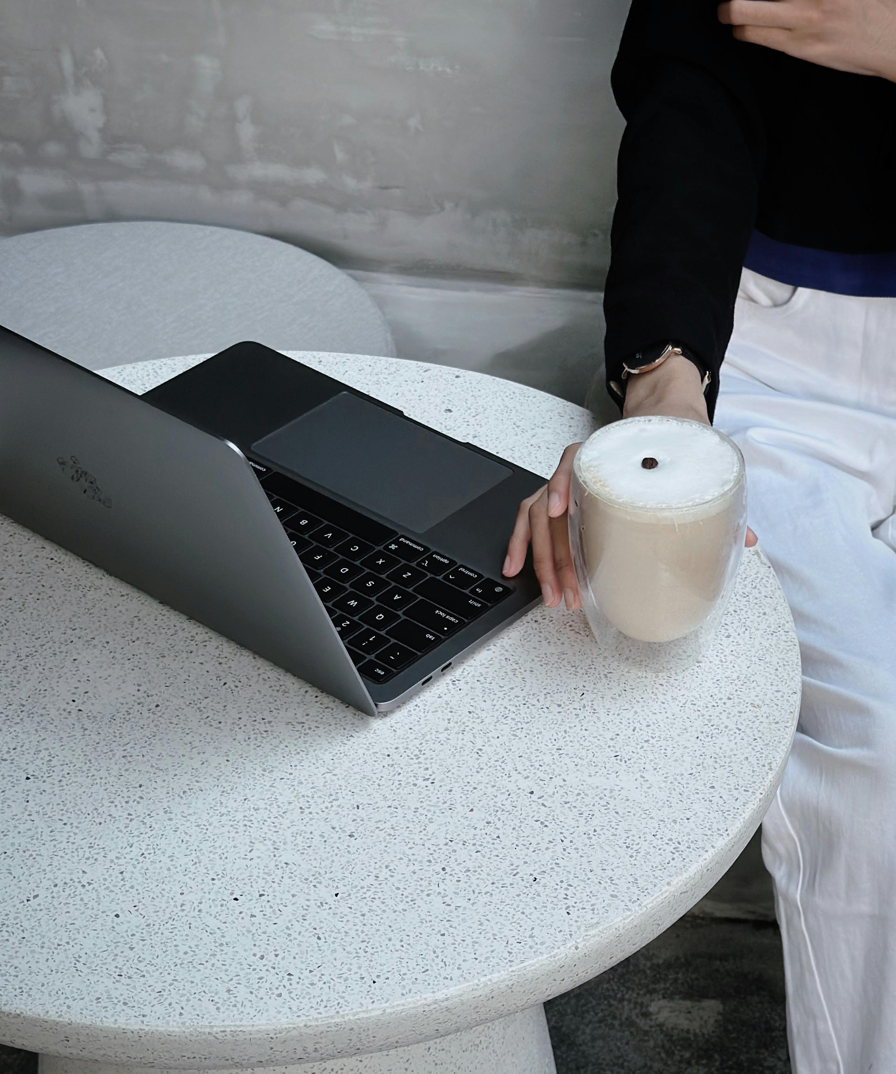 Modern Laptop and Coffee on Cafe Table · Free Stock Photo