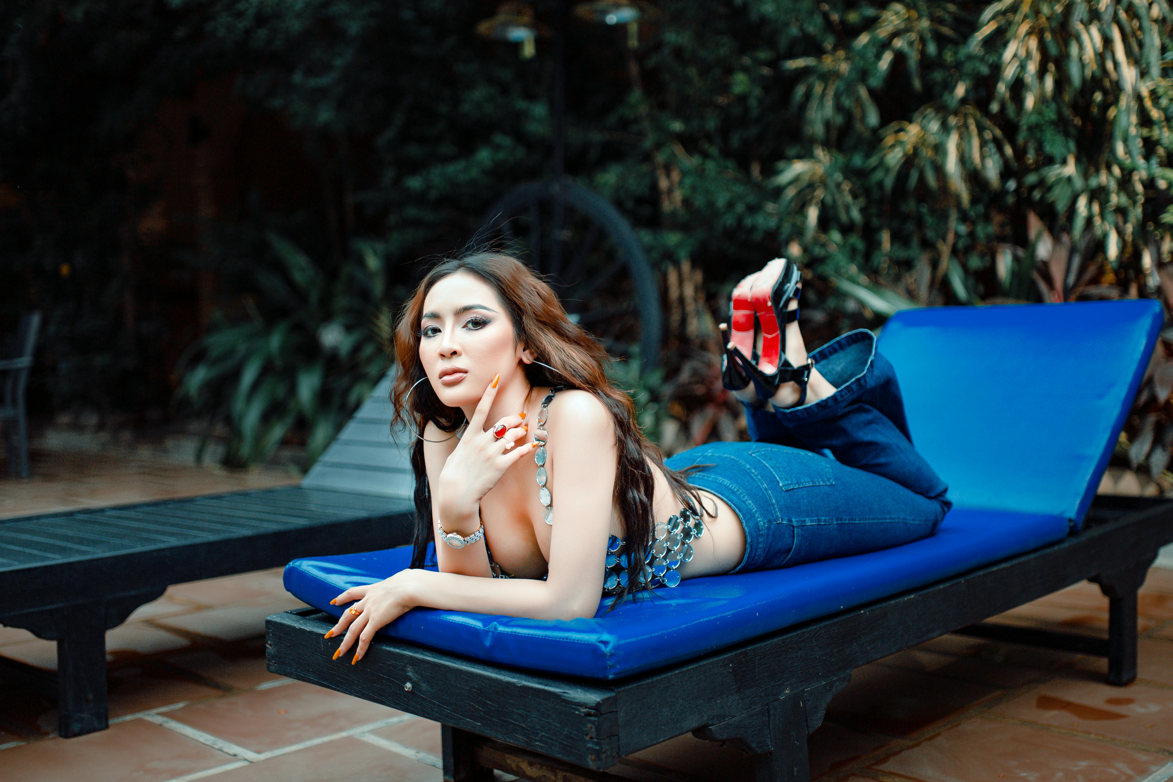 Young Woman Lying on a Sunlounger · Free Stock Photo