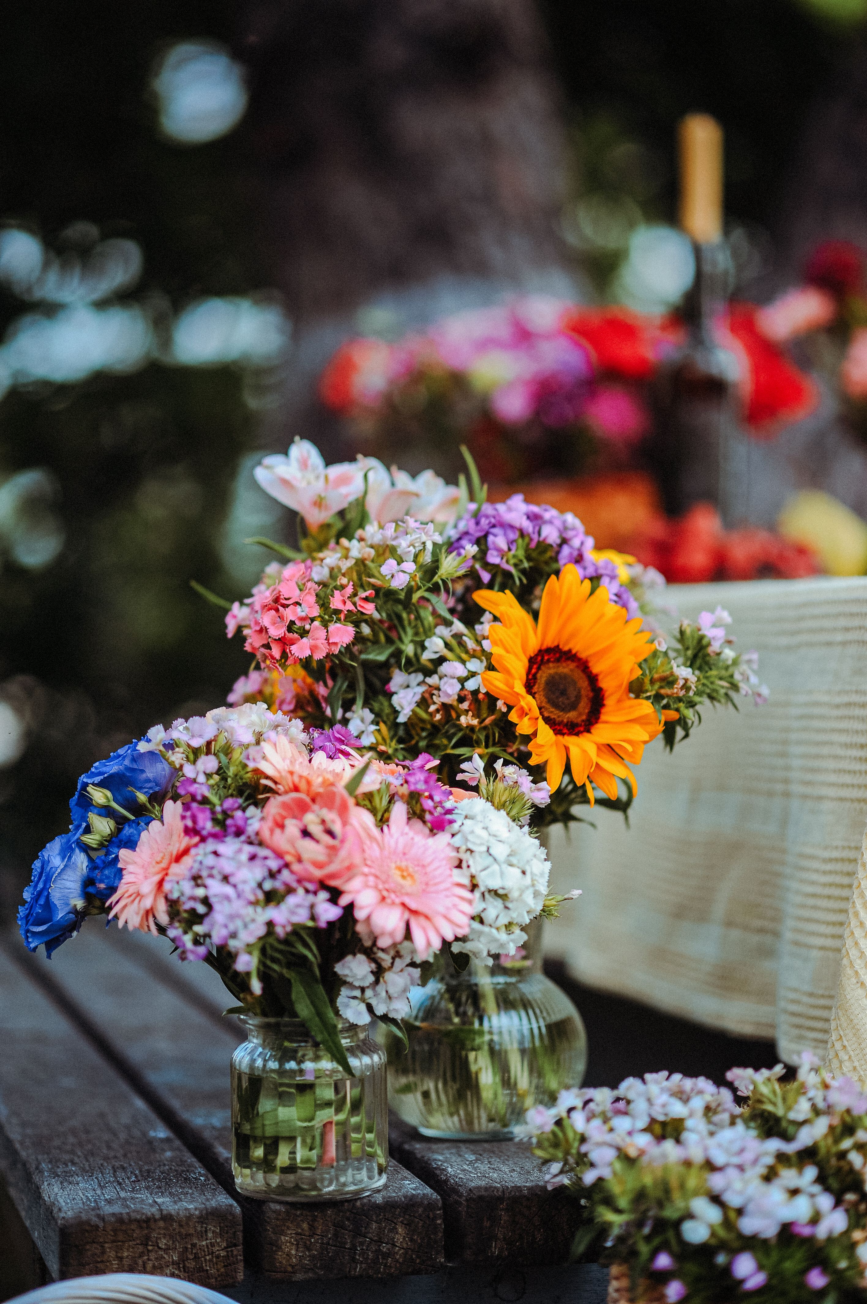 Colorful Flower Decoration on the Table Outside · Free Stock Photo