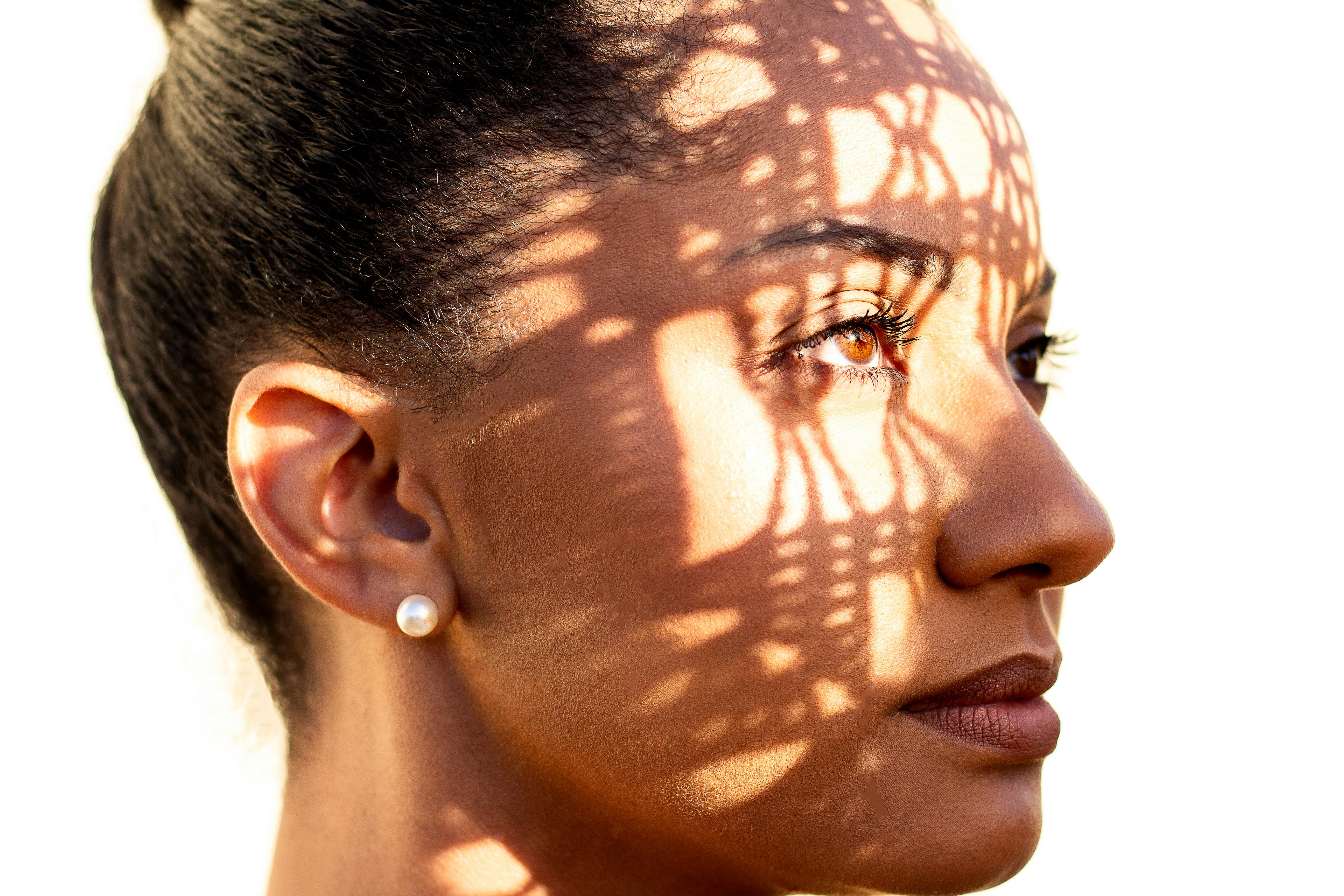 Shadows on Sunlit Woman Face · Free Stock Photo