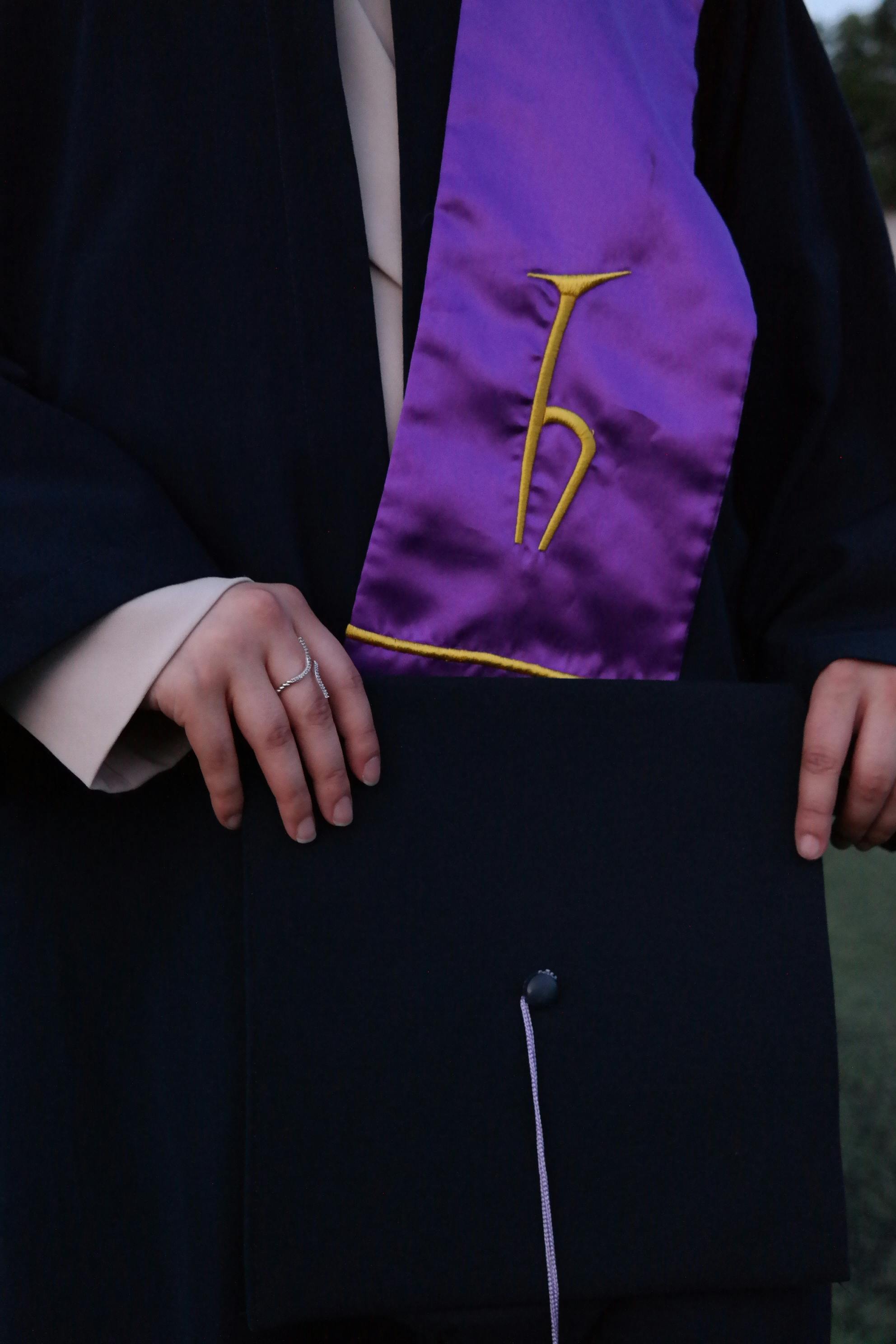 Woman in a Graduation Gown · Free Stock Photo
