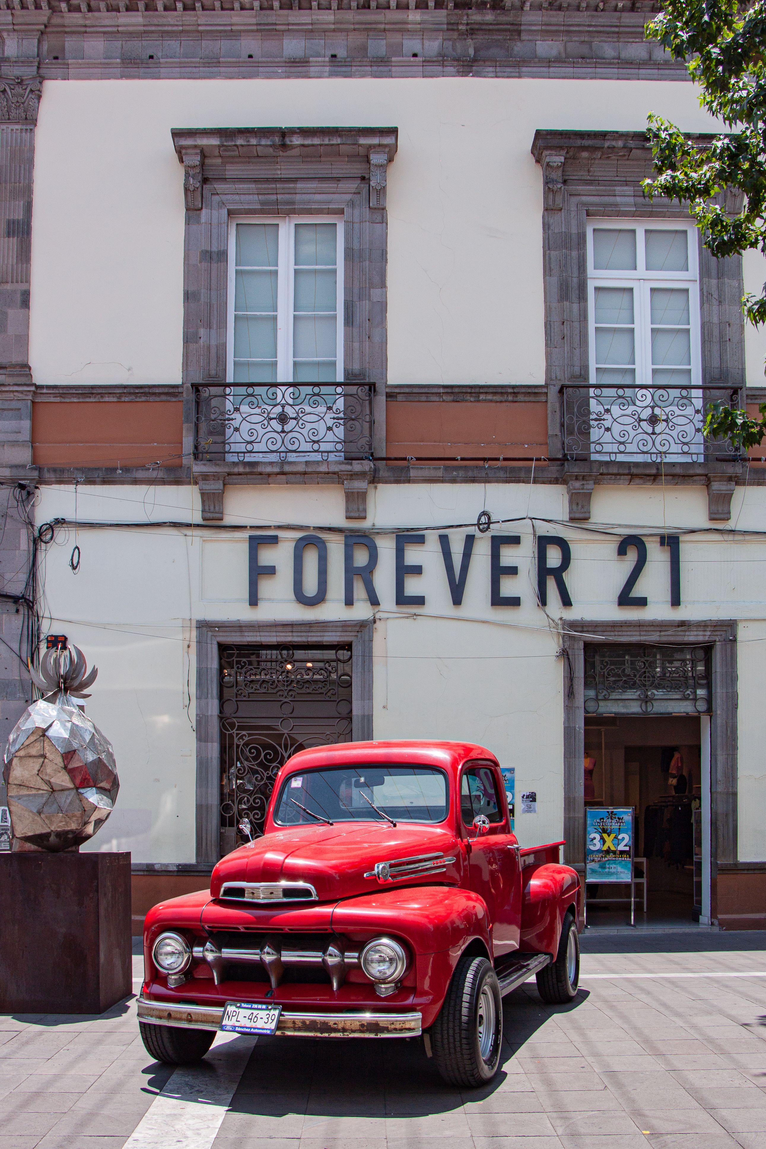 Red Ford Pick-up F1 Parked in front of the Store · Free Stock Photo