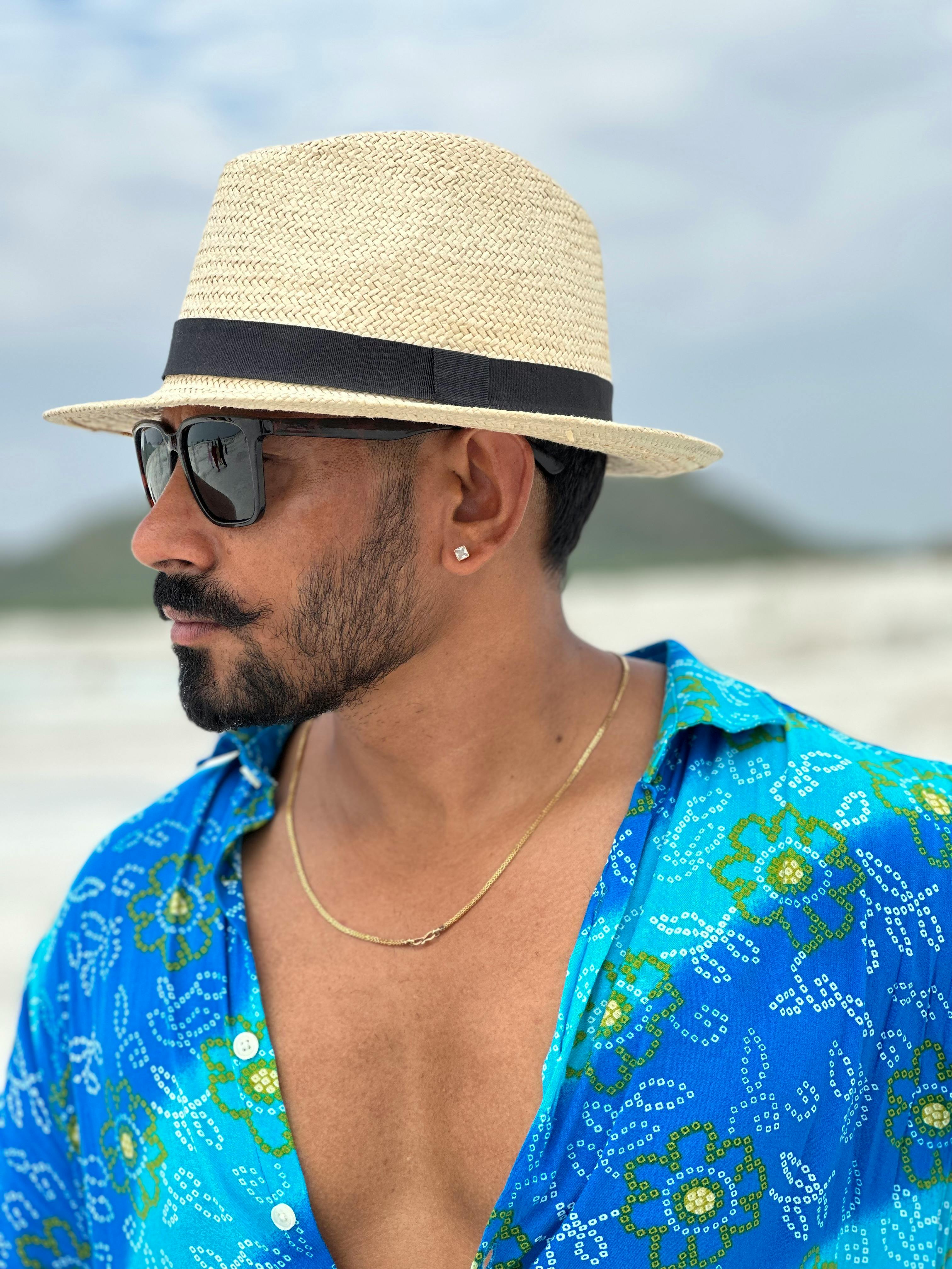 Model Adjusting His Hat · Free Stock Photo