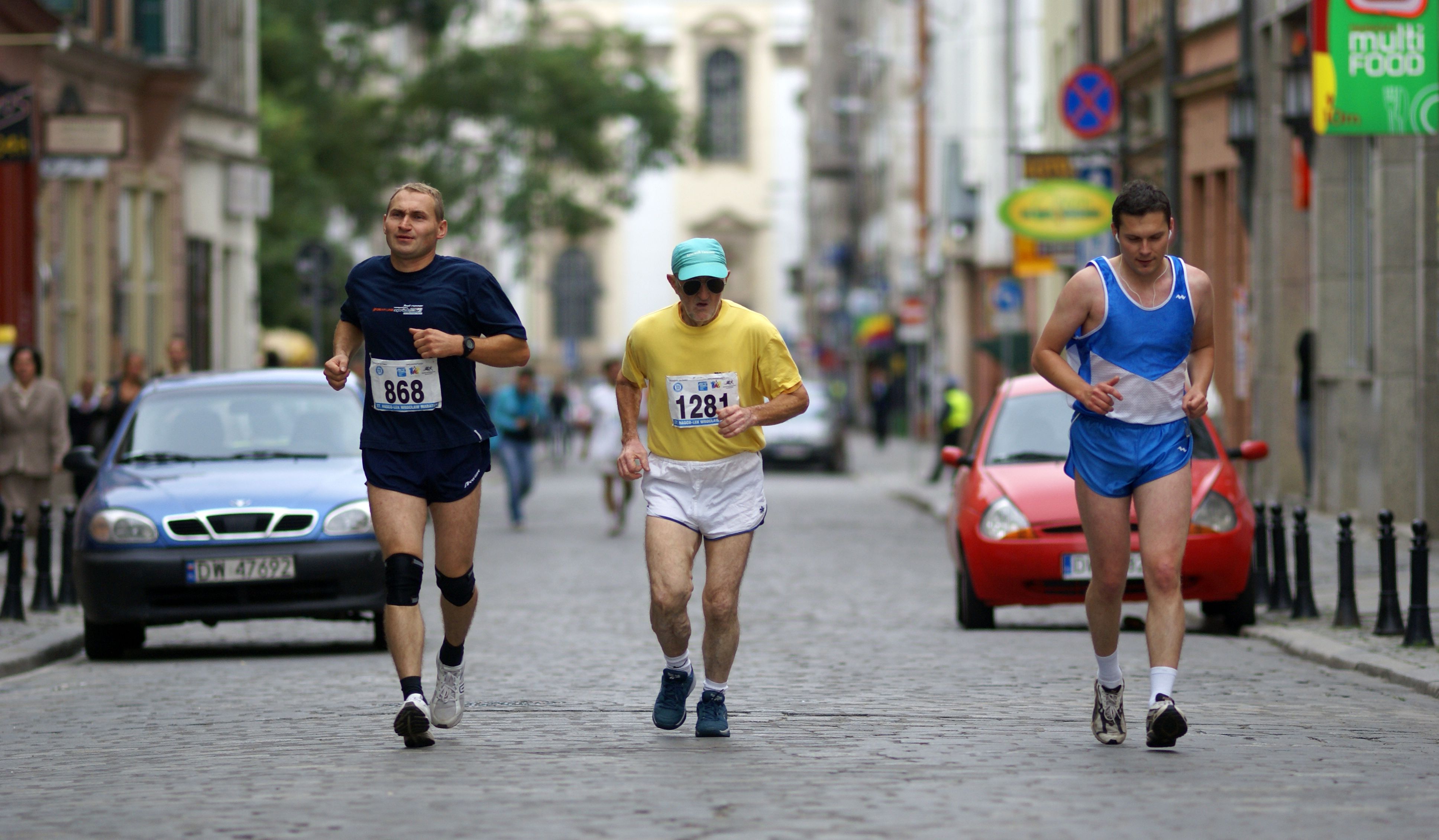 Men Running in Race on Street · Free Stock Photo