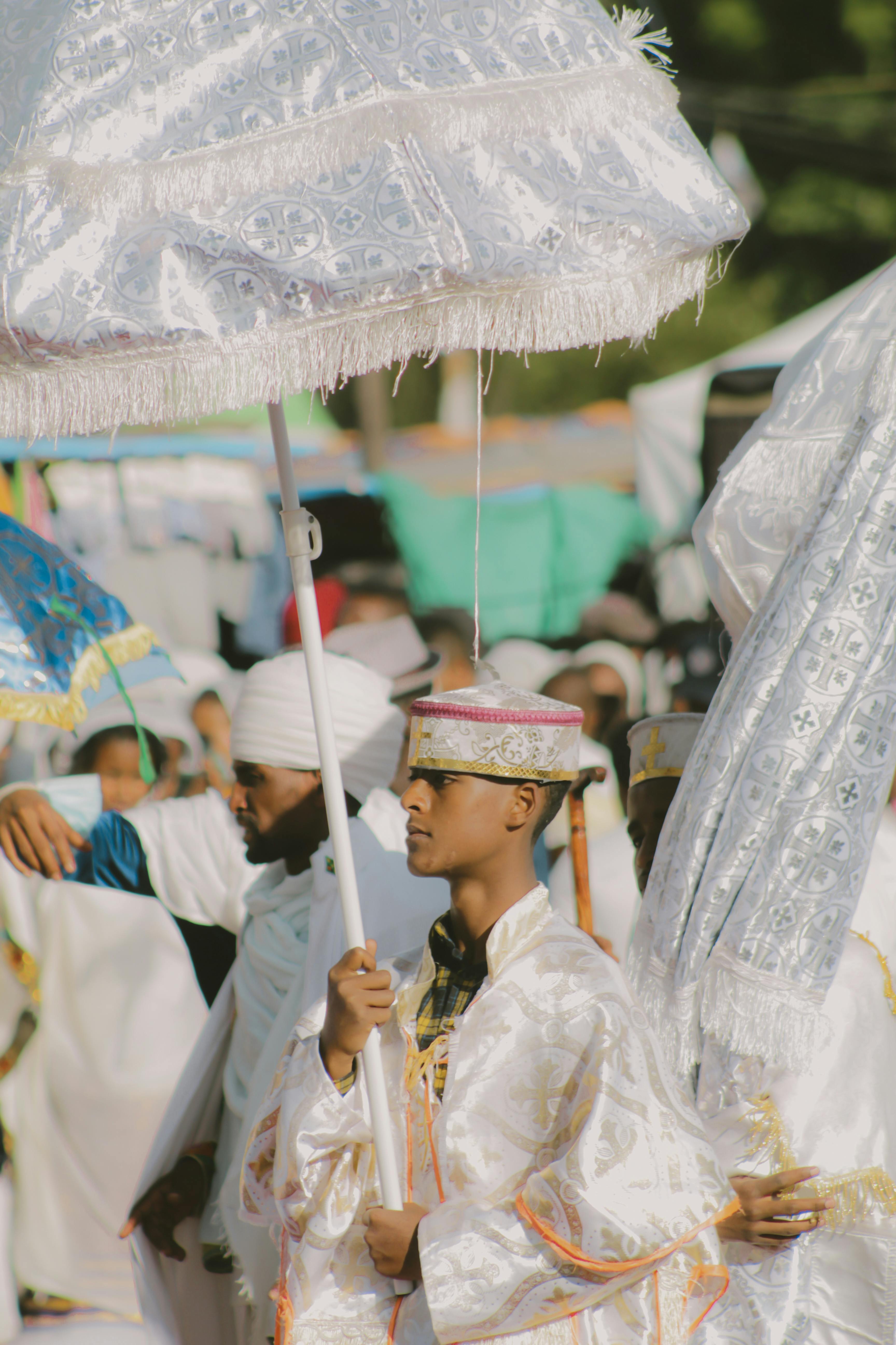 People in White, Traditional Clothing on Parade · Free Stock Photo