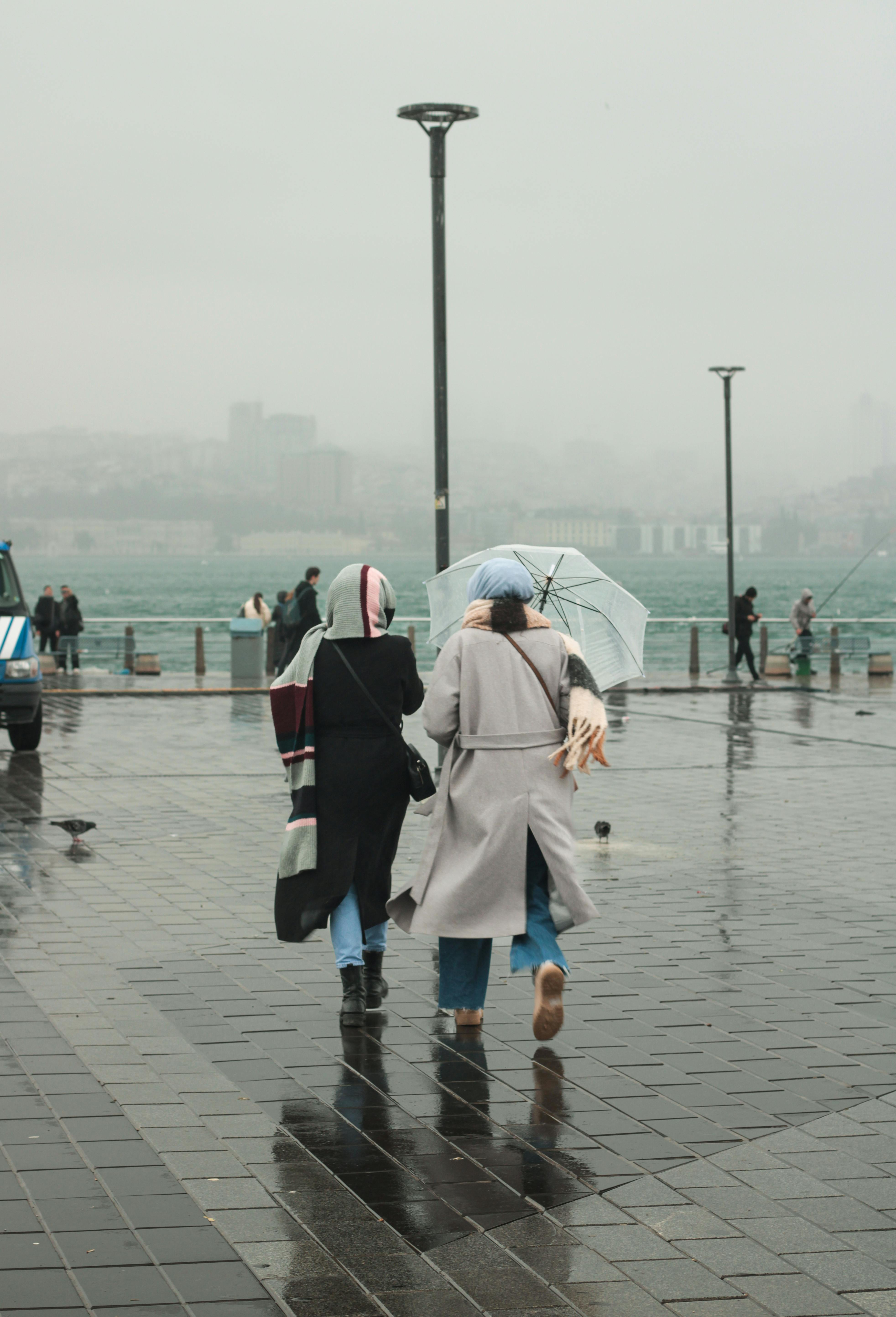 Tourist at Promenade by River · Free Stock Photo
