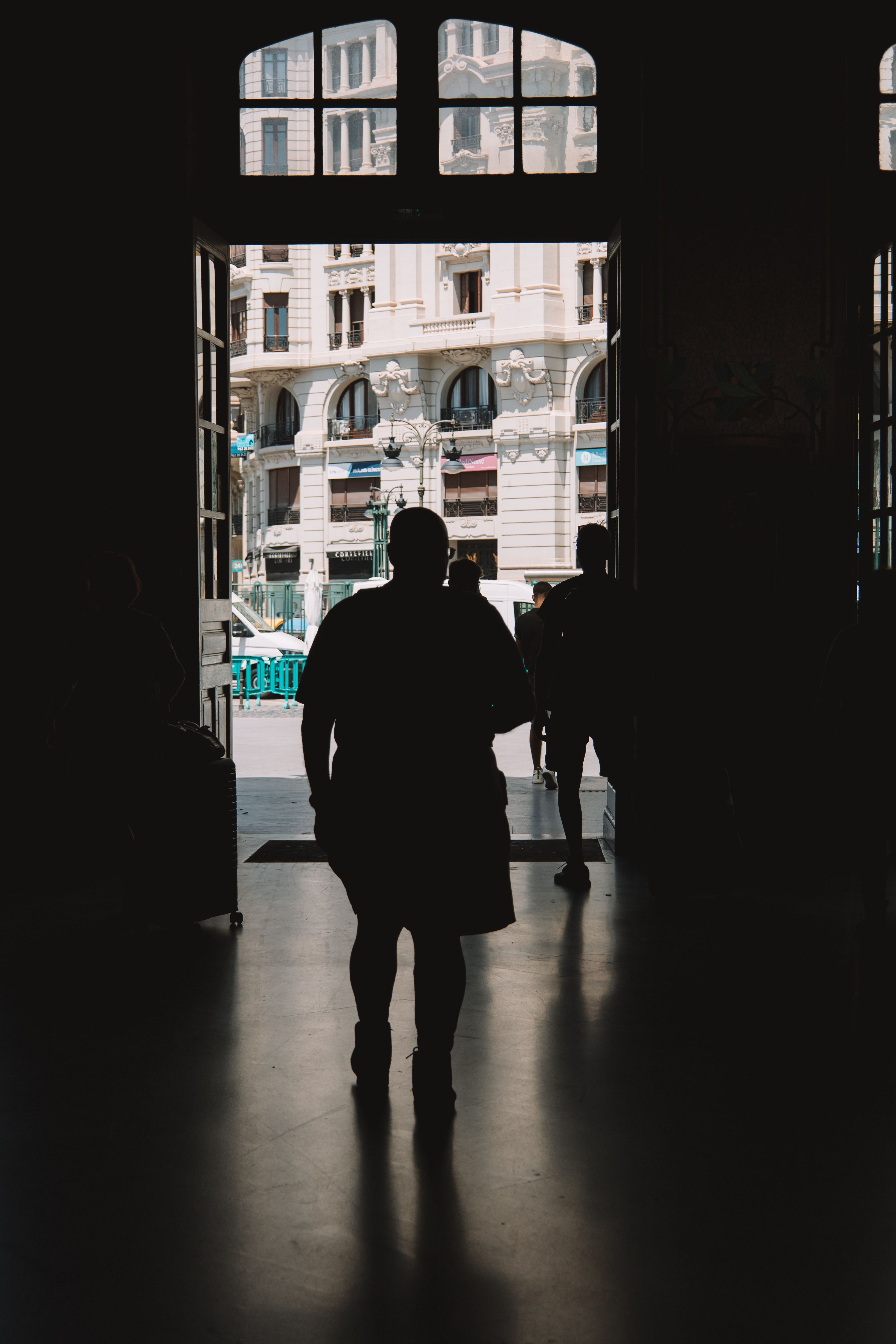 Person Standing in Darkness near Exit · Free Stock Photo