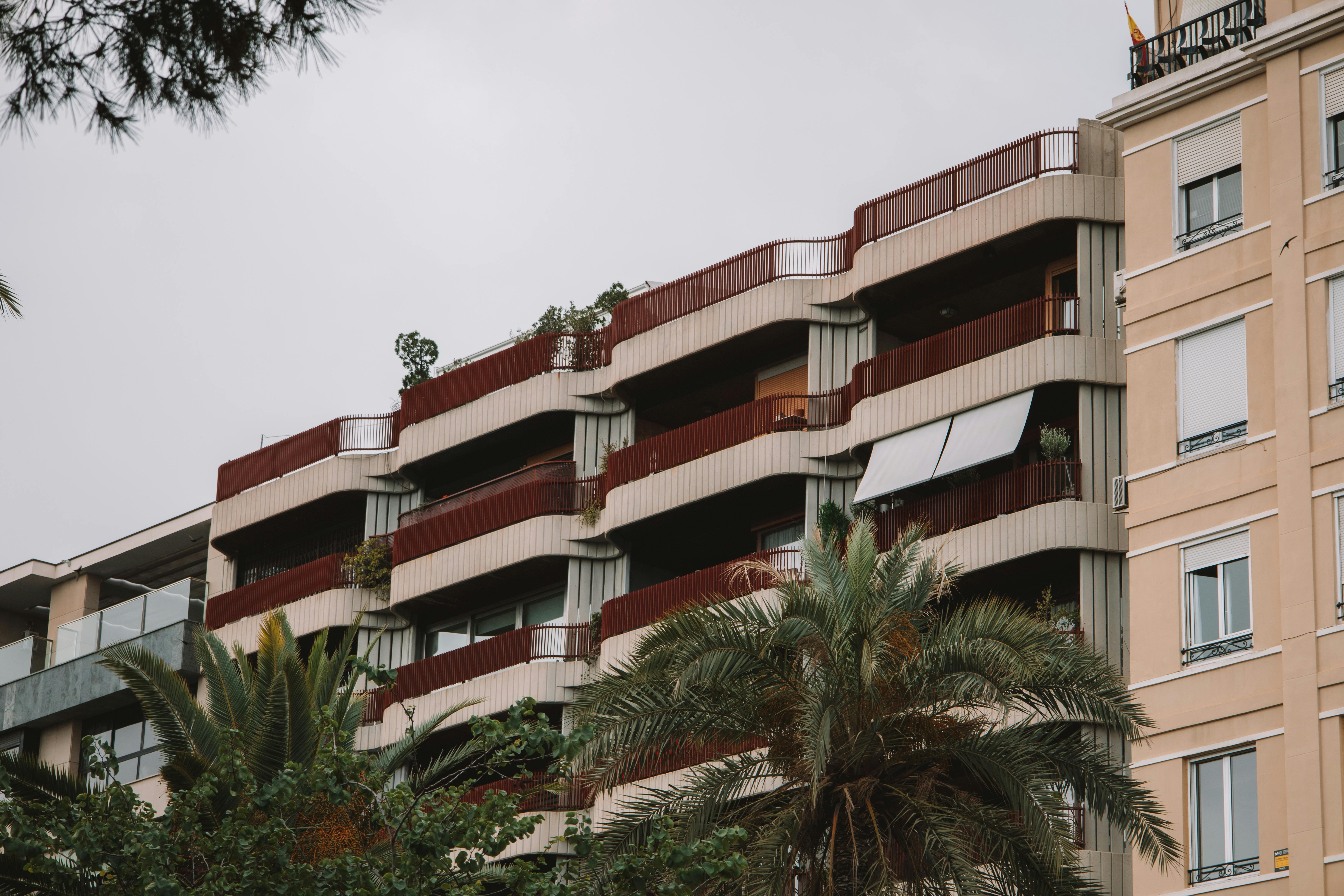 Balconies of a Luxury Apartment Block Seen behind Palm Trees · Free ...
