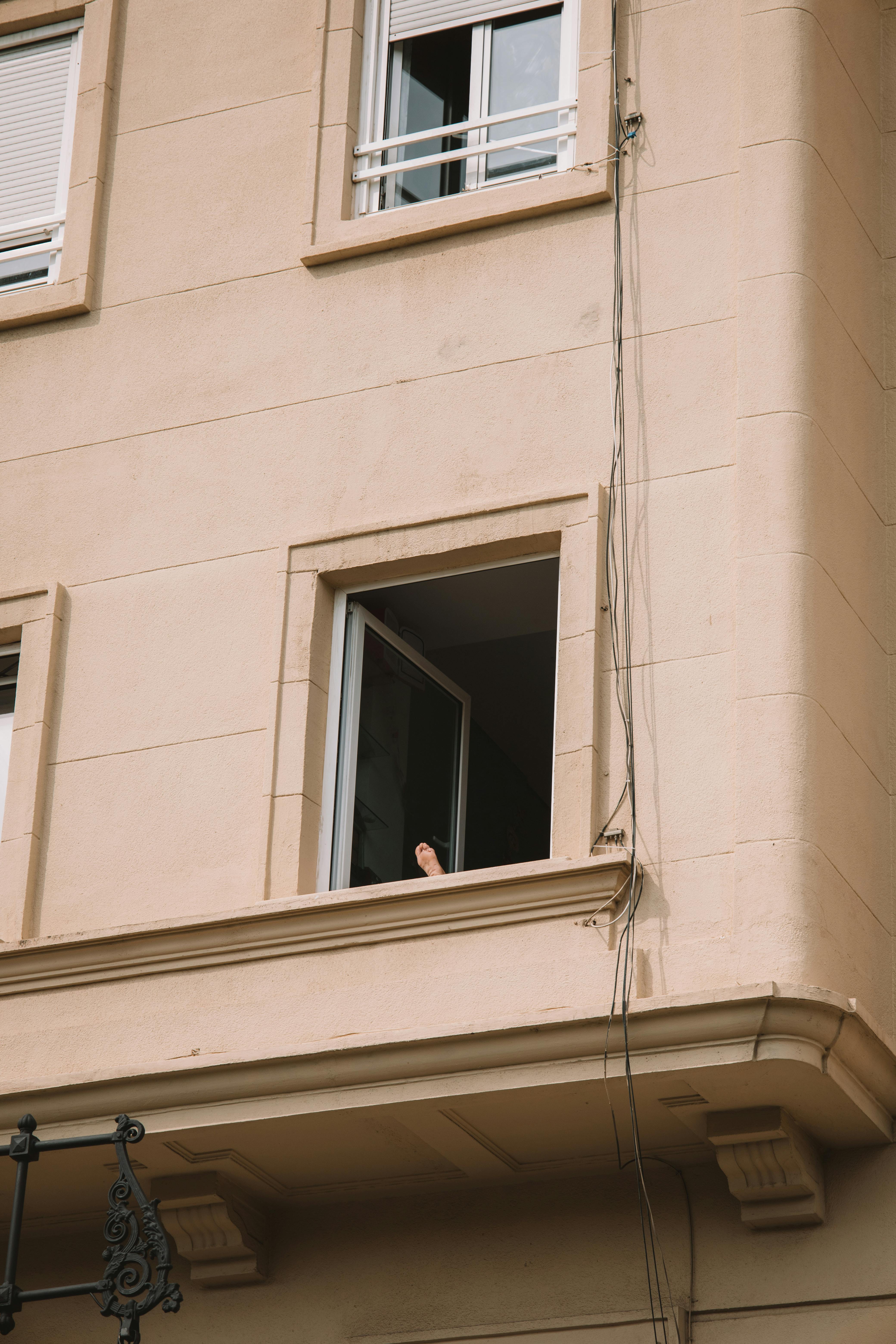 Open Window in an Apartment Building · Free Stock Photo