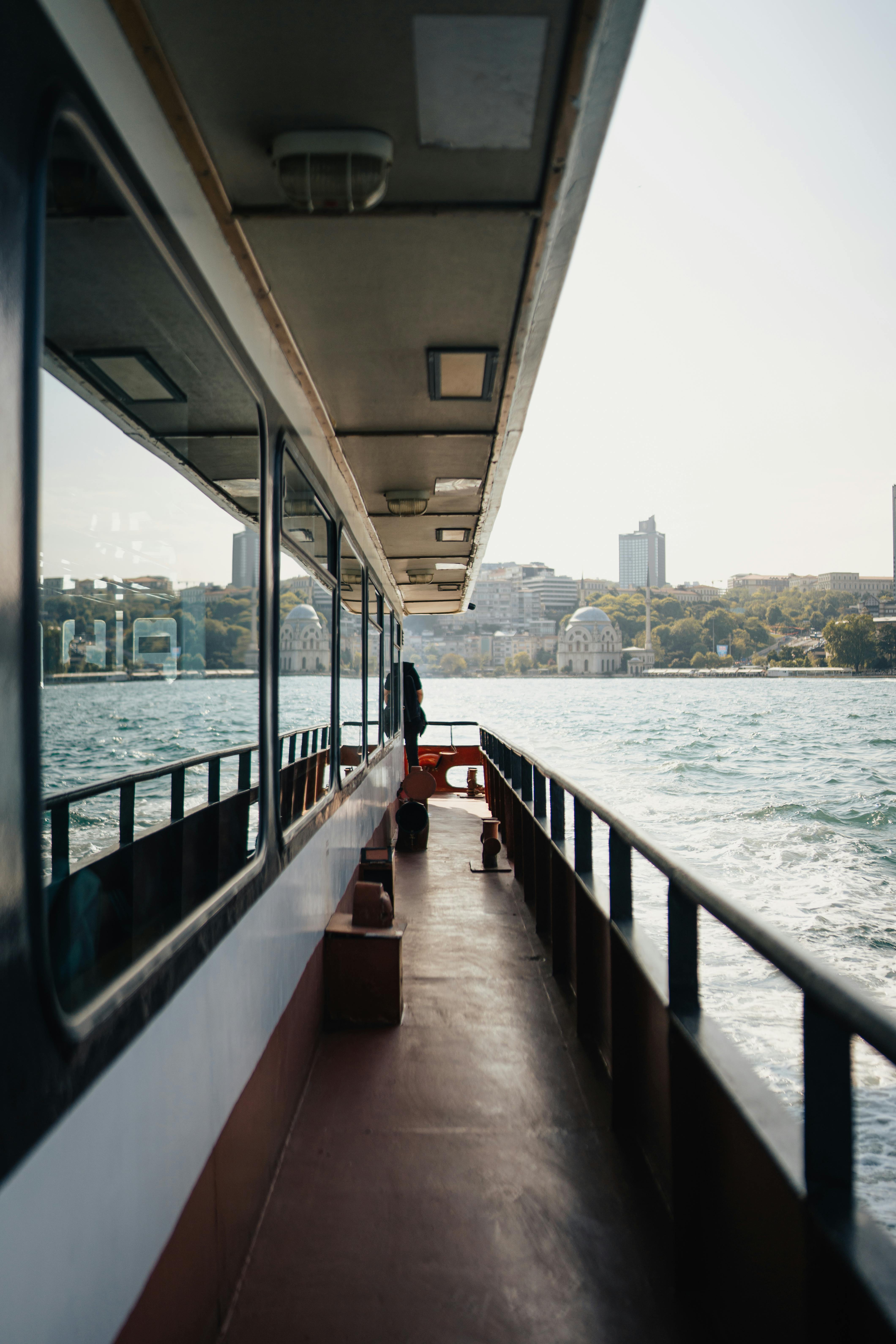 Sea Reflecting in Ferry Windows · Free Stock Photo