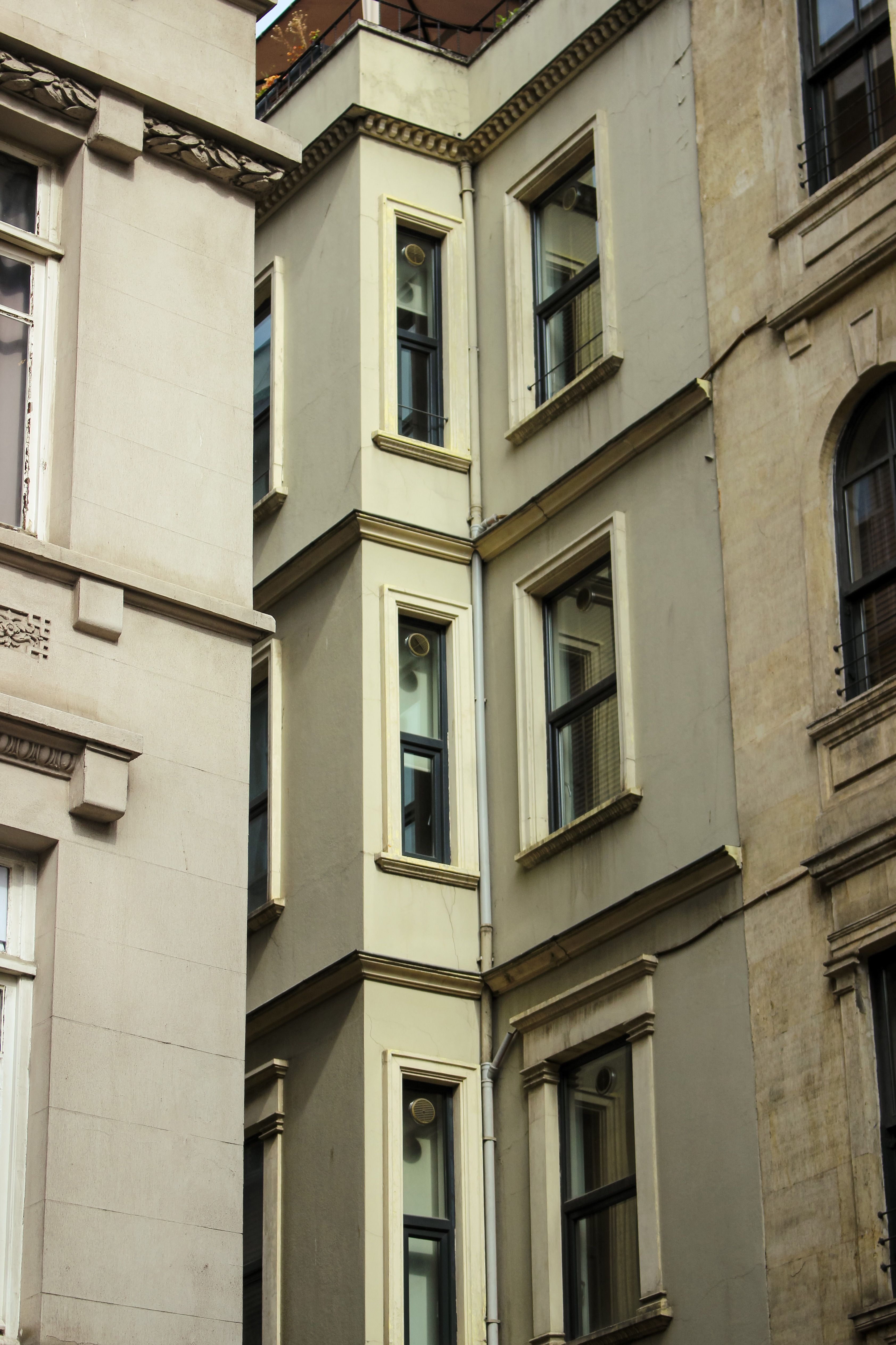 Windows around Building Corner · Free Stock Photo