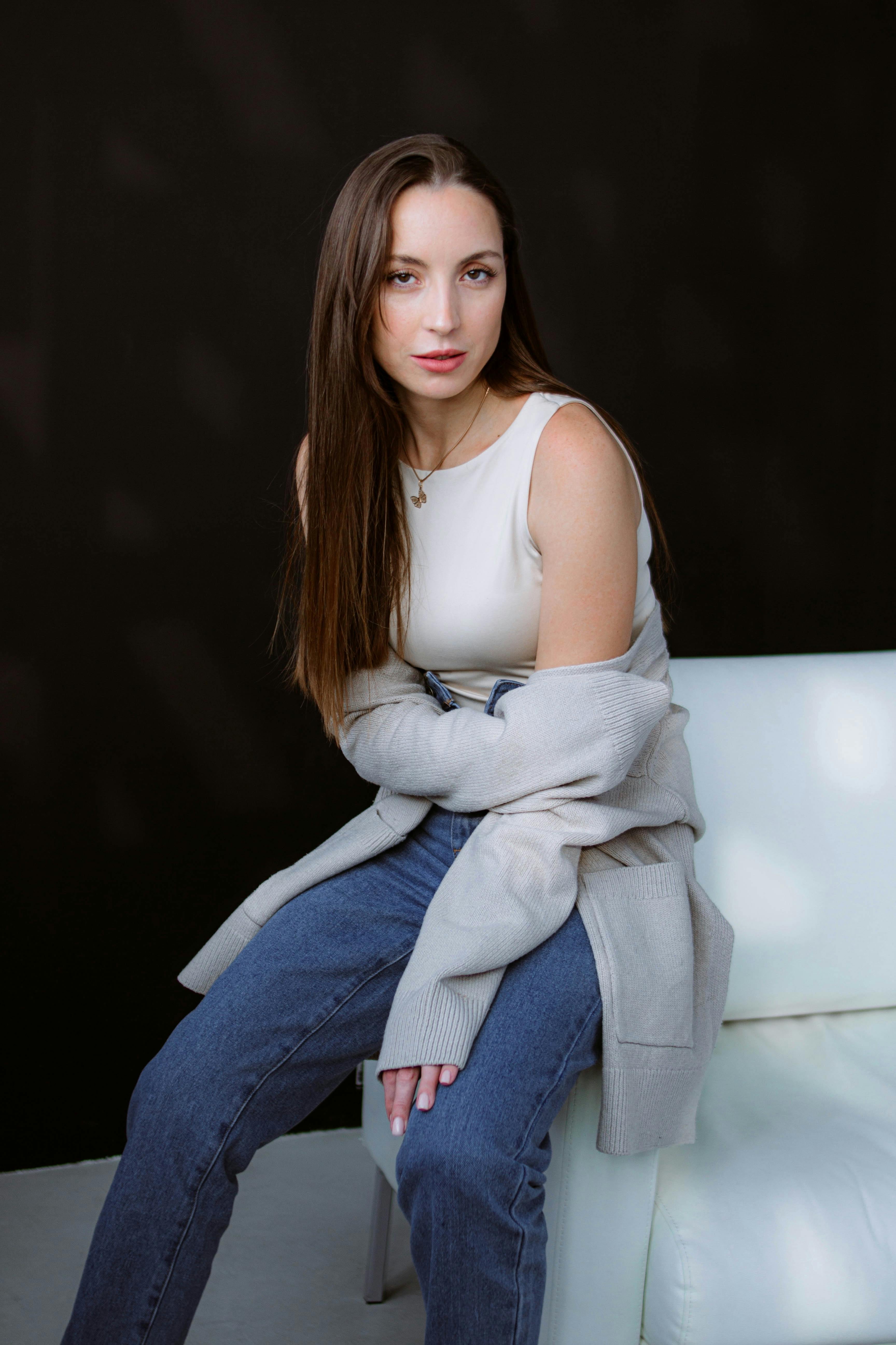 Woman Sitting in Brown Leather Sofa · Free Stock Photo
