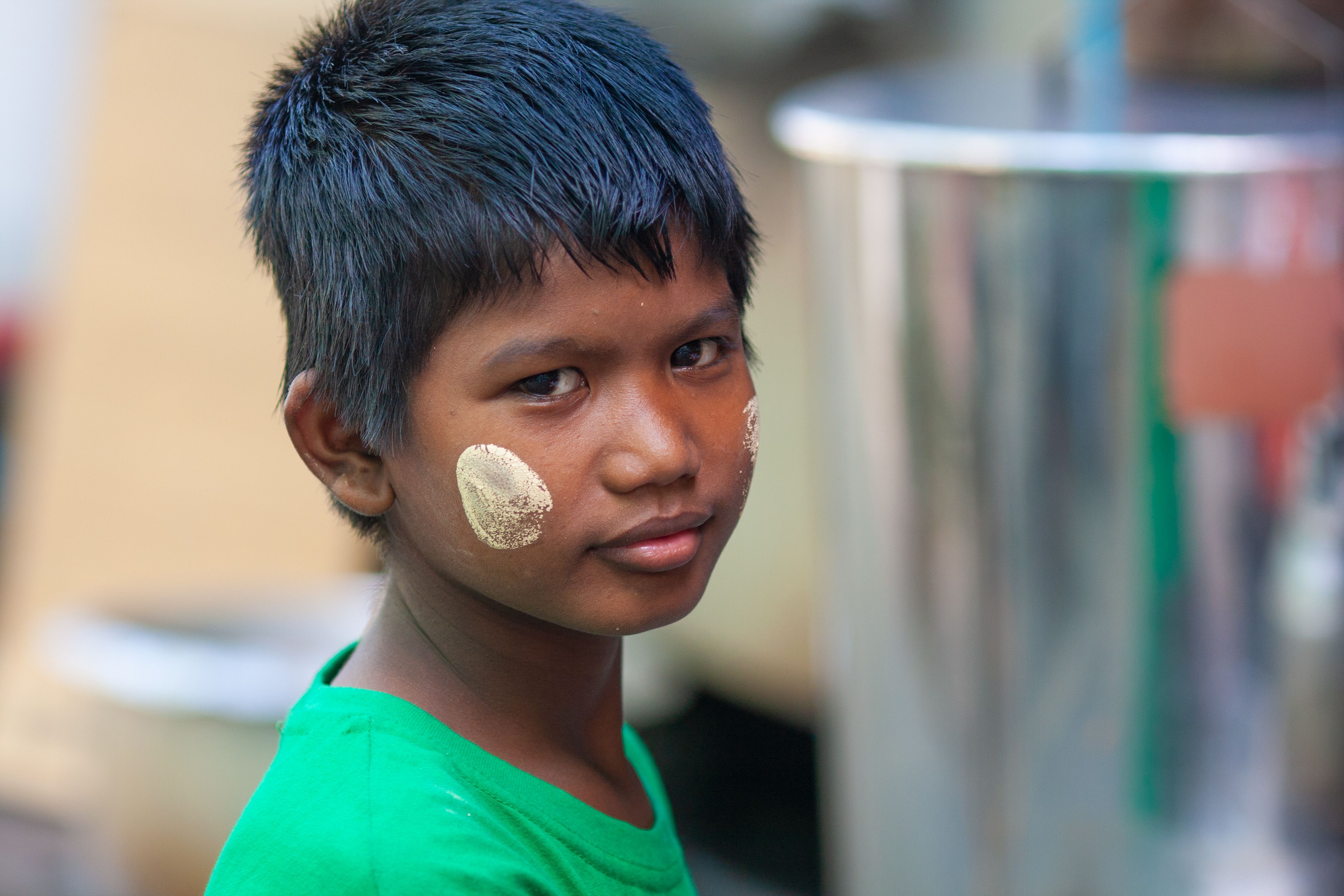 A Young Boy with Dots Painted on His Cheeks · Free Stock Photo