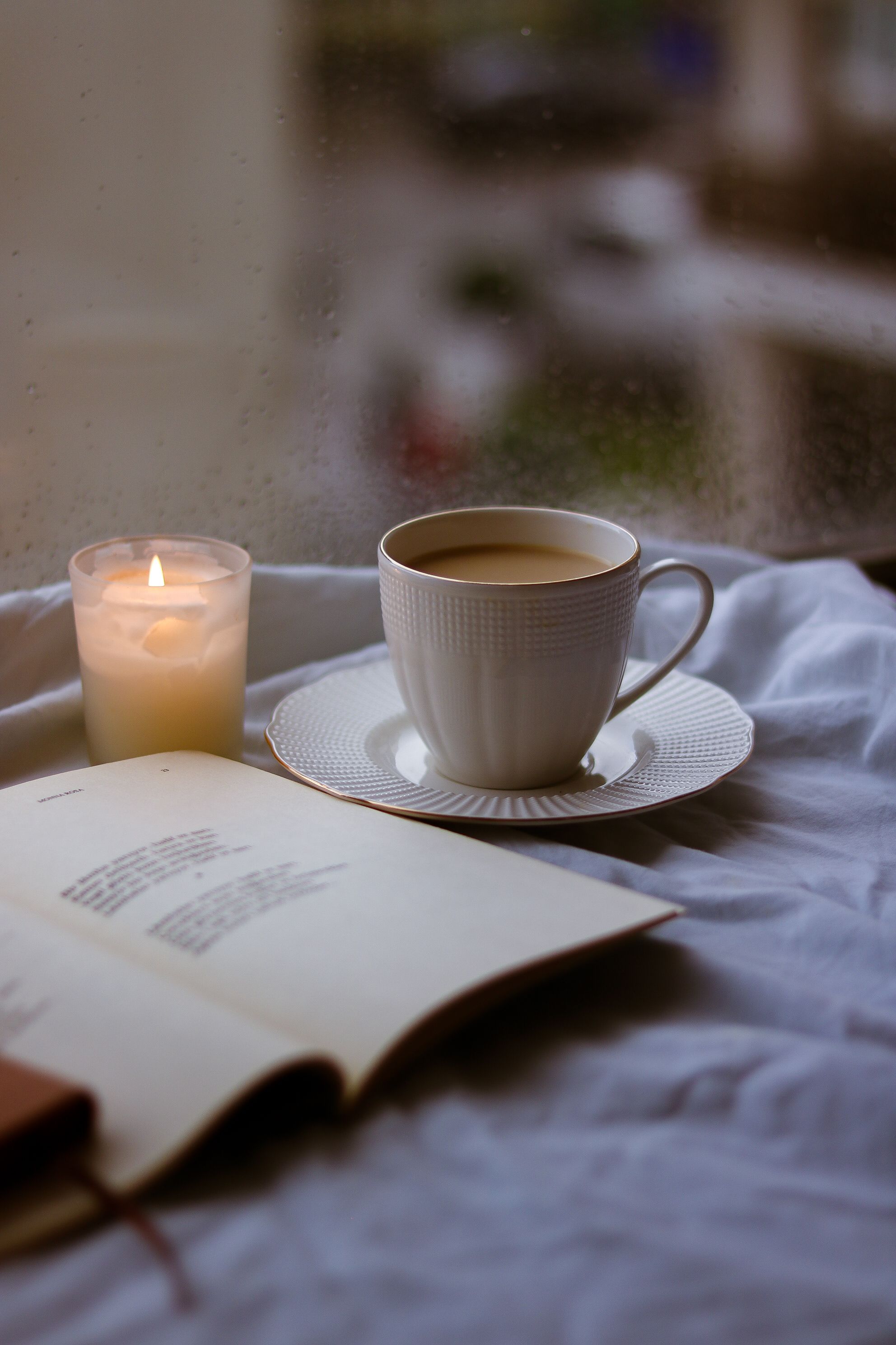 Cup of Coffee on Stack of Books by Window · Free Stock Photo