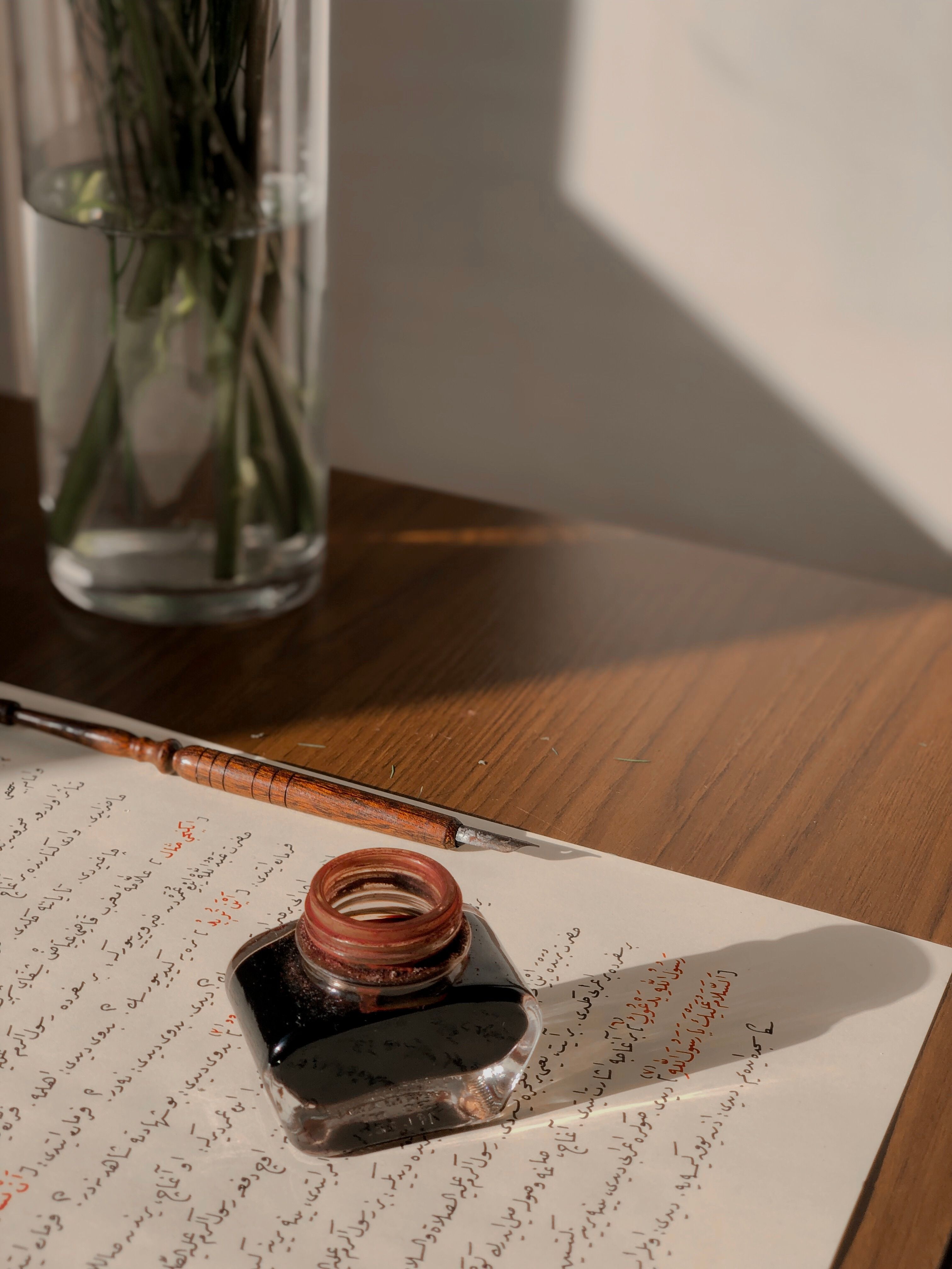 Person dipping Quill Pen in an Ink · Free Stock Photo