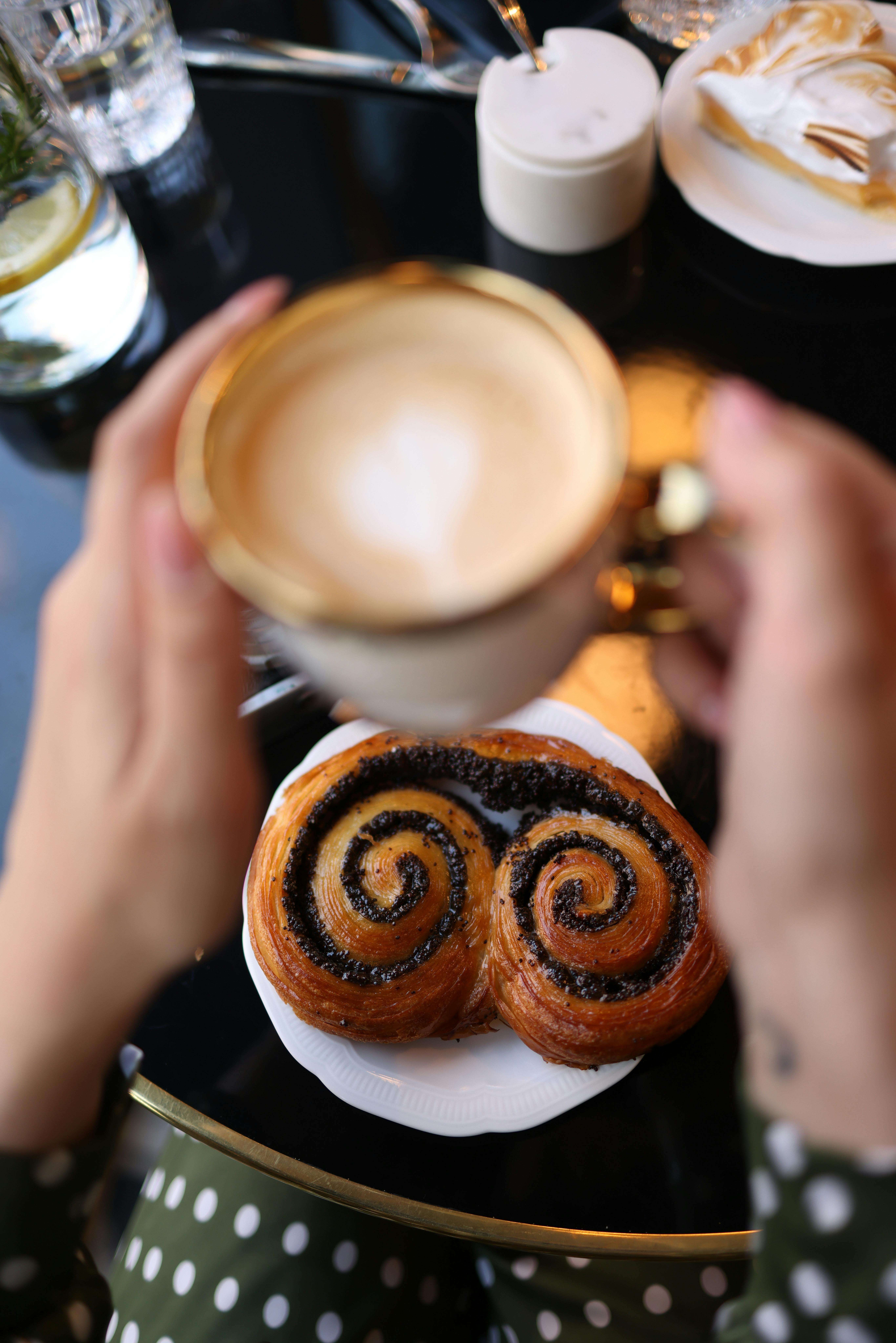 Woman Sitting with Coffee Cup · Free Stock Photo