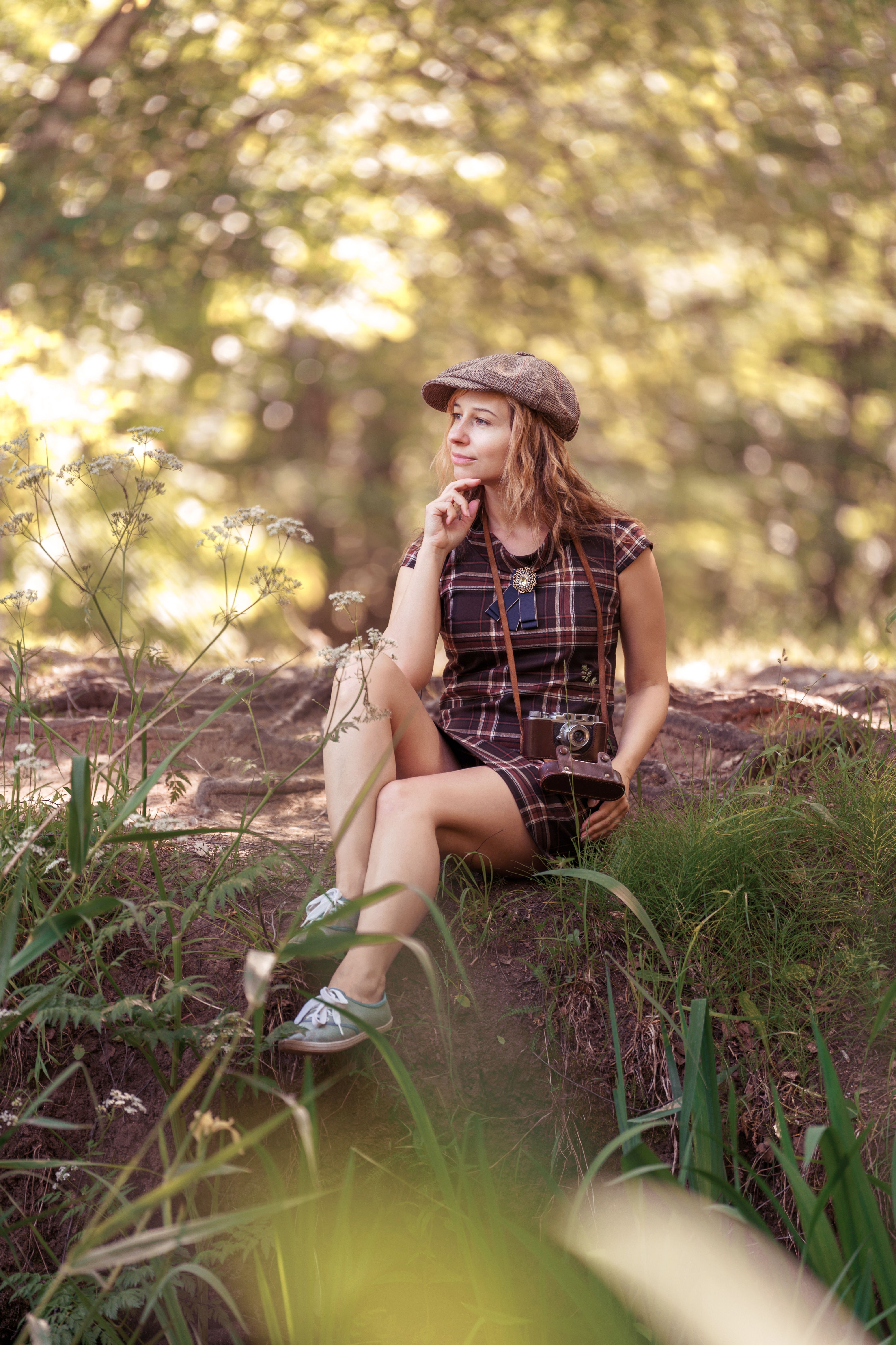 Woman Sitting and Posing in Forest · Free Stock Photo