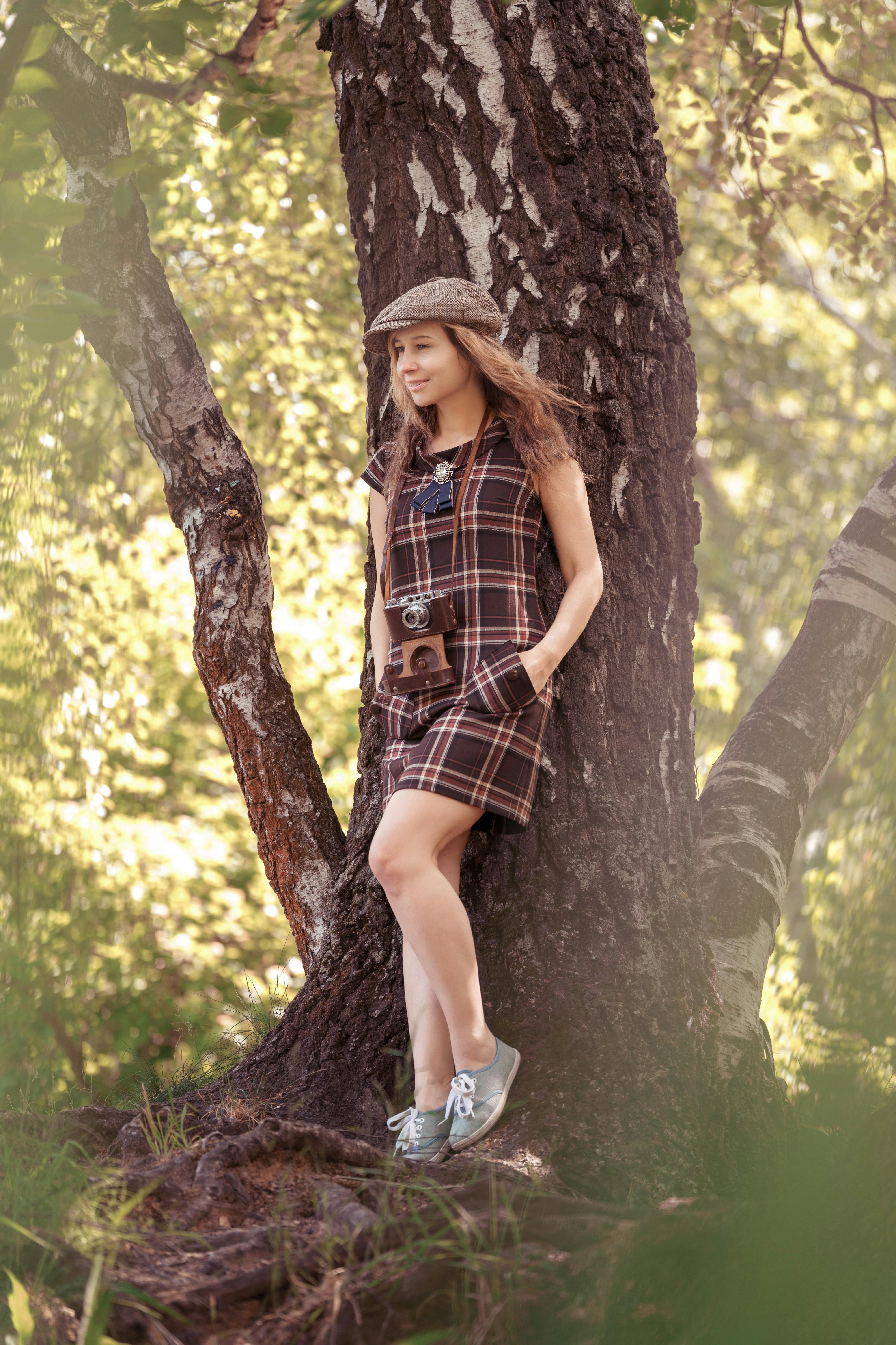 Smiling Woman Posing by Tree in Forest · Free Stock Photo
