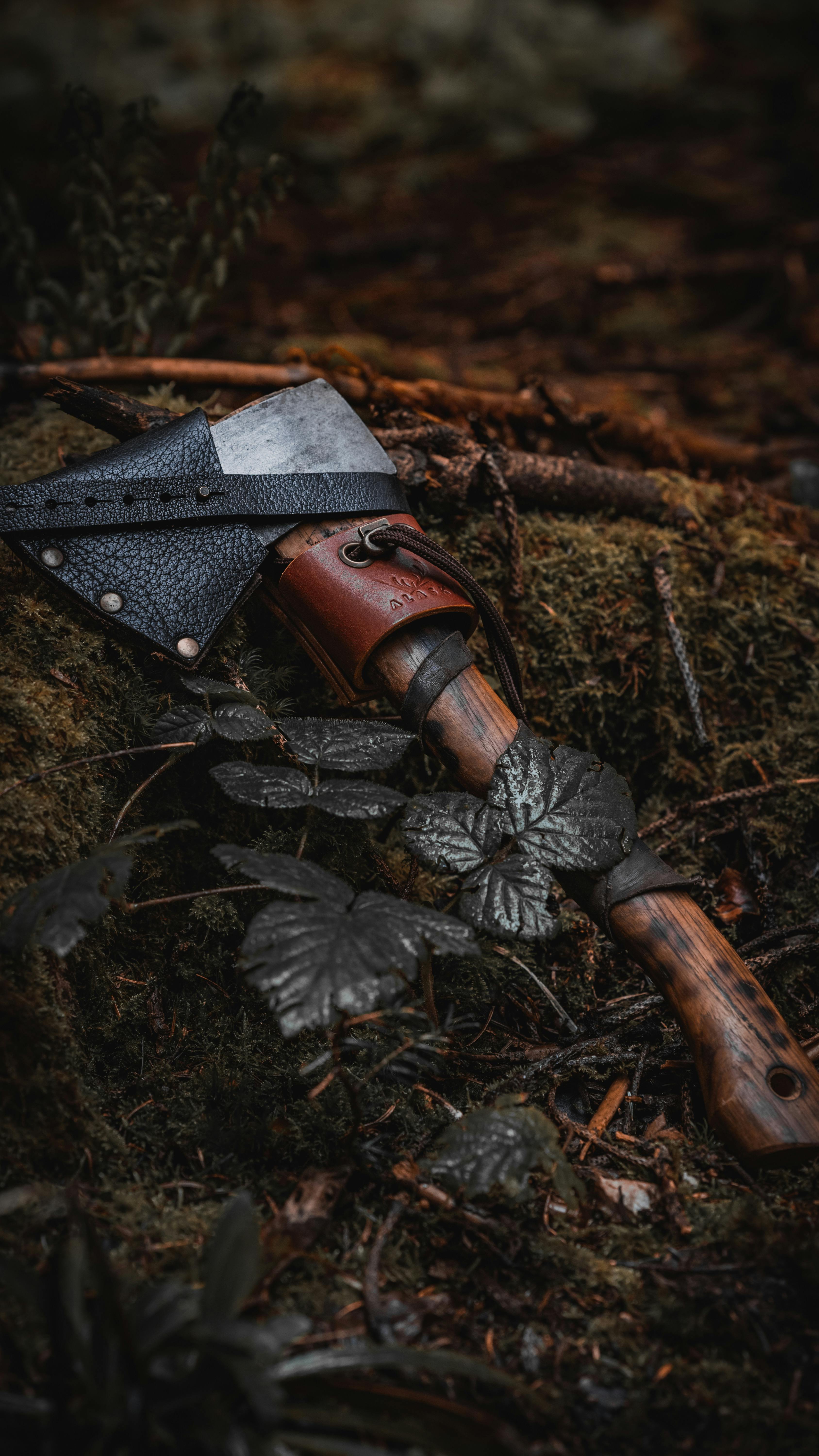 Brown Wooden Axe Besides Brown Leather Knife Holster · Free Stock Photo