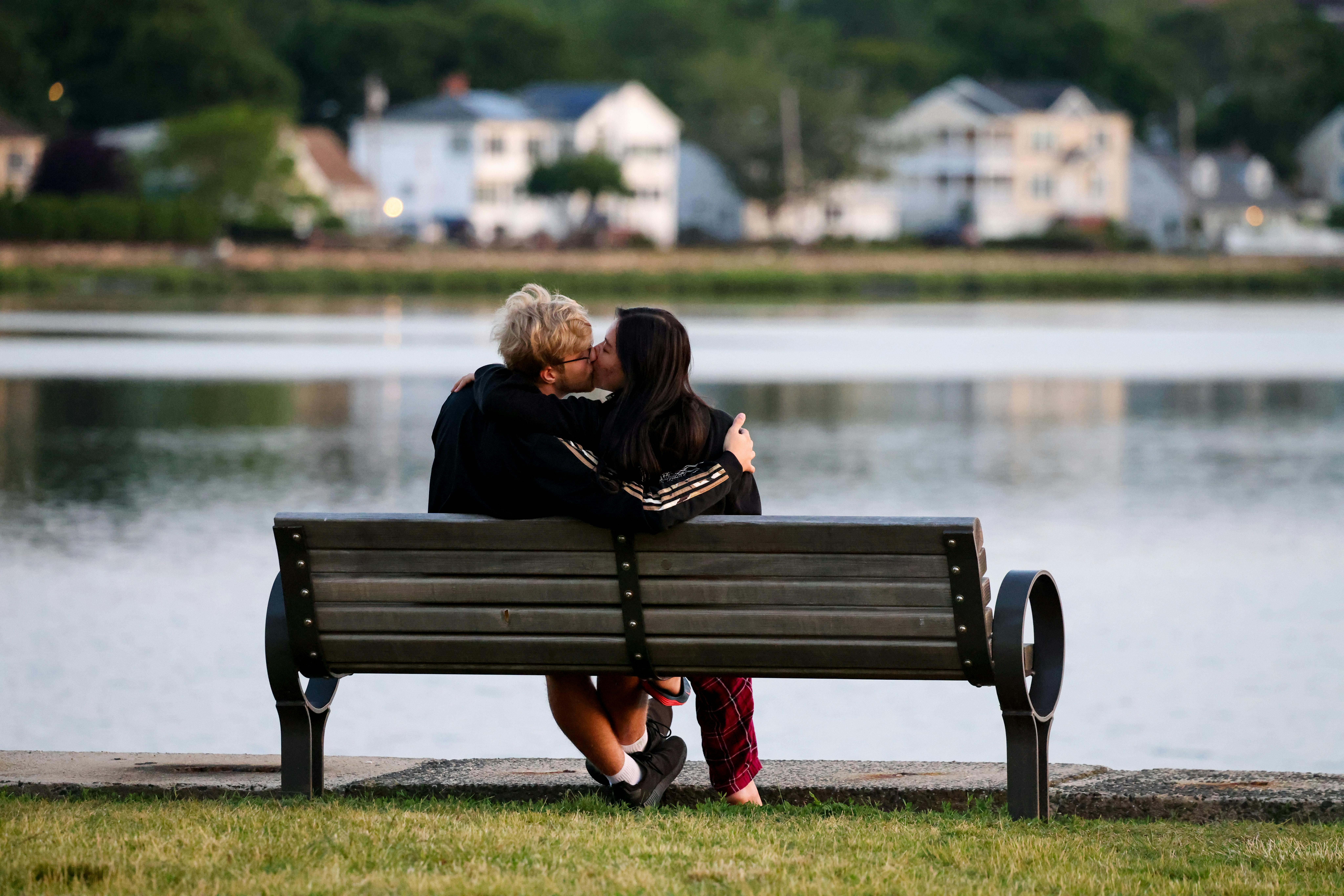 Couple Kissing on Bench · Free Stock Photo