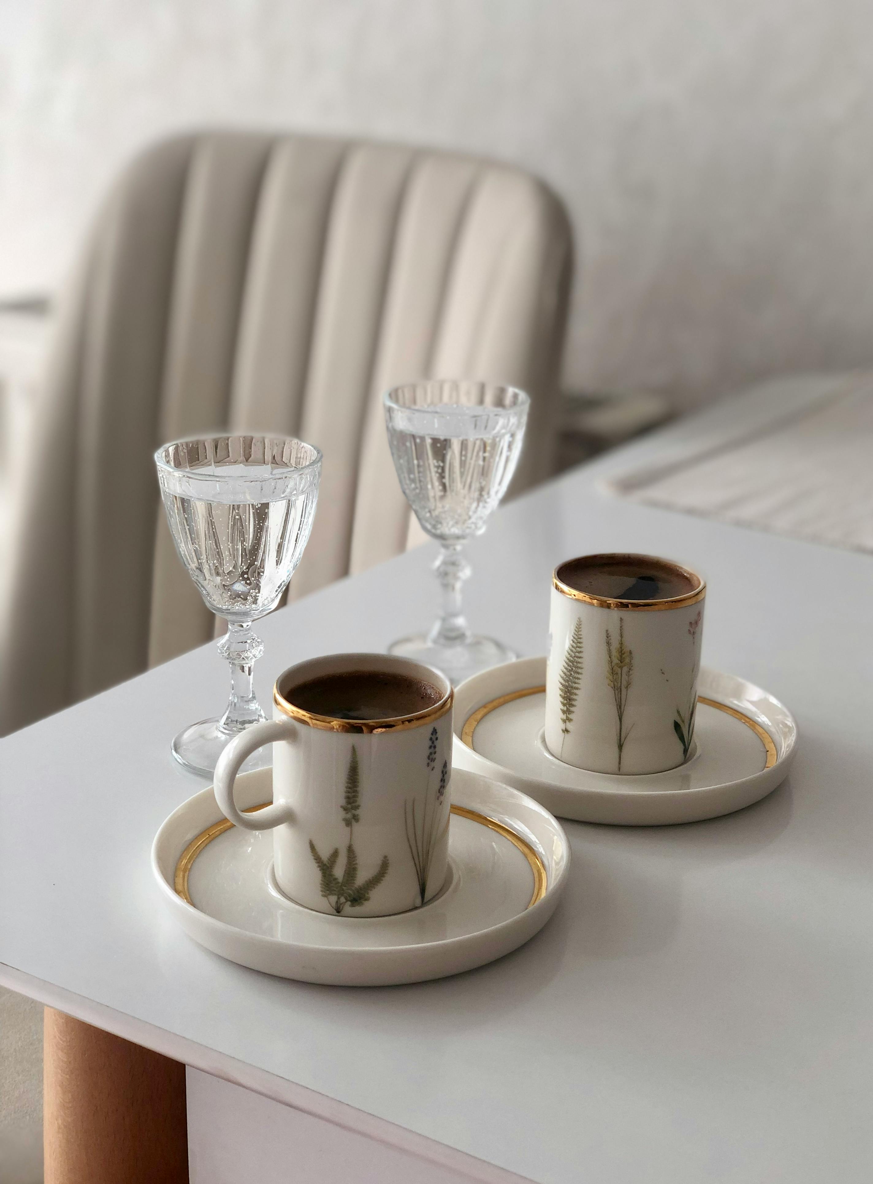 Coffee and Water on Plate · Free Stock Photo