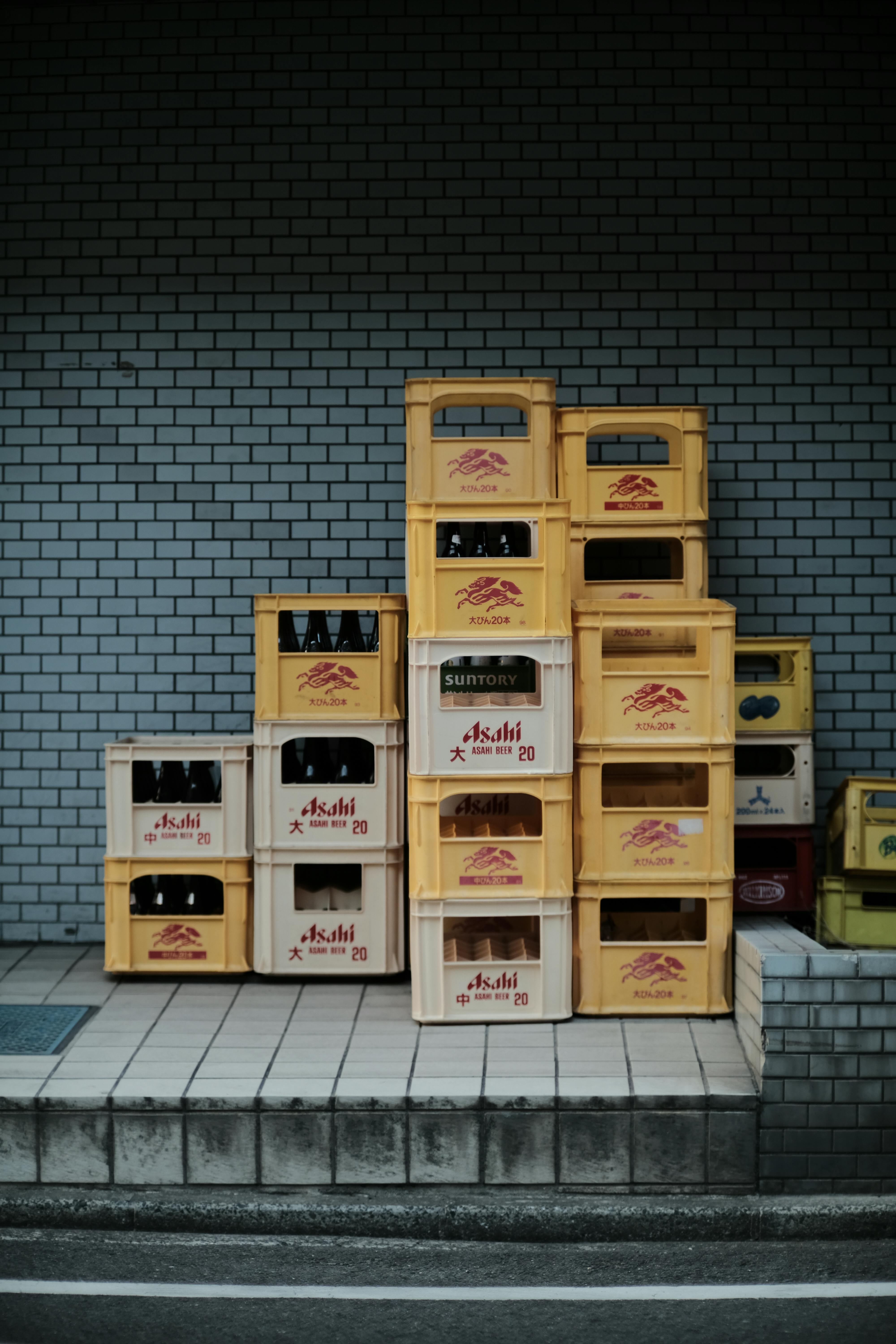 Boxes Stacked near Wall · Free Stock Photo
