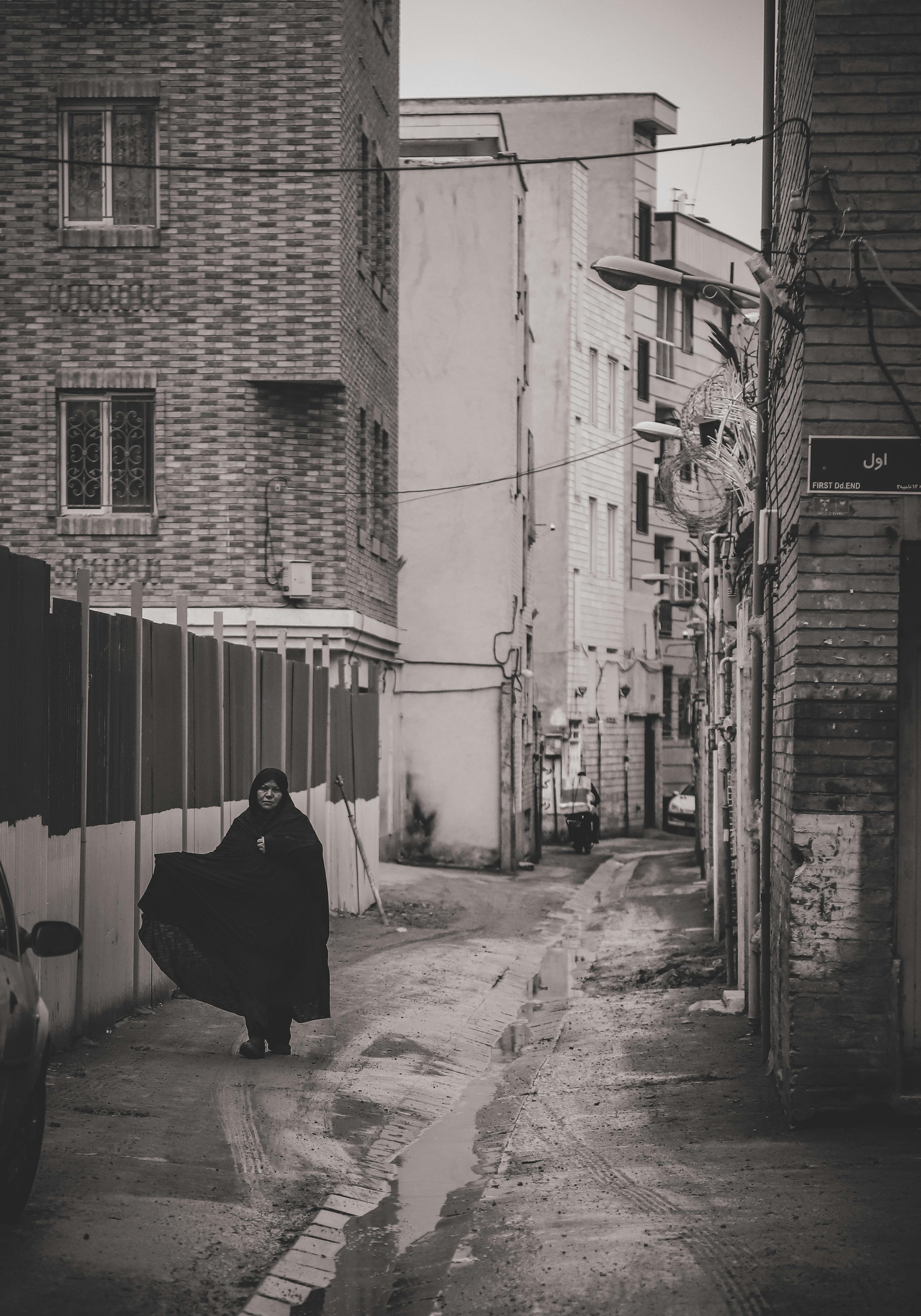Person Standing on Street in Town · Free Stock Photo